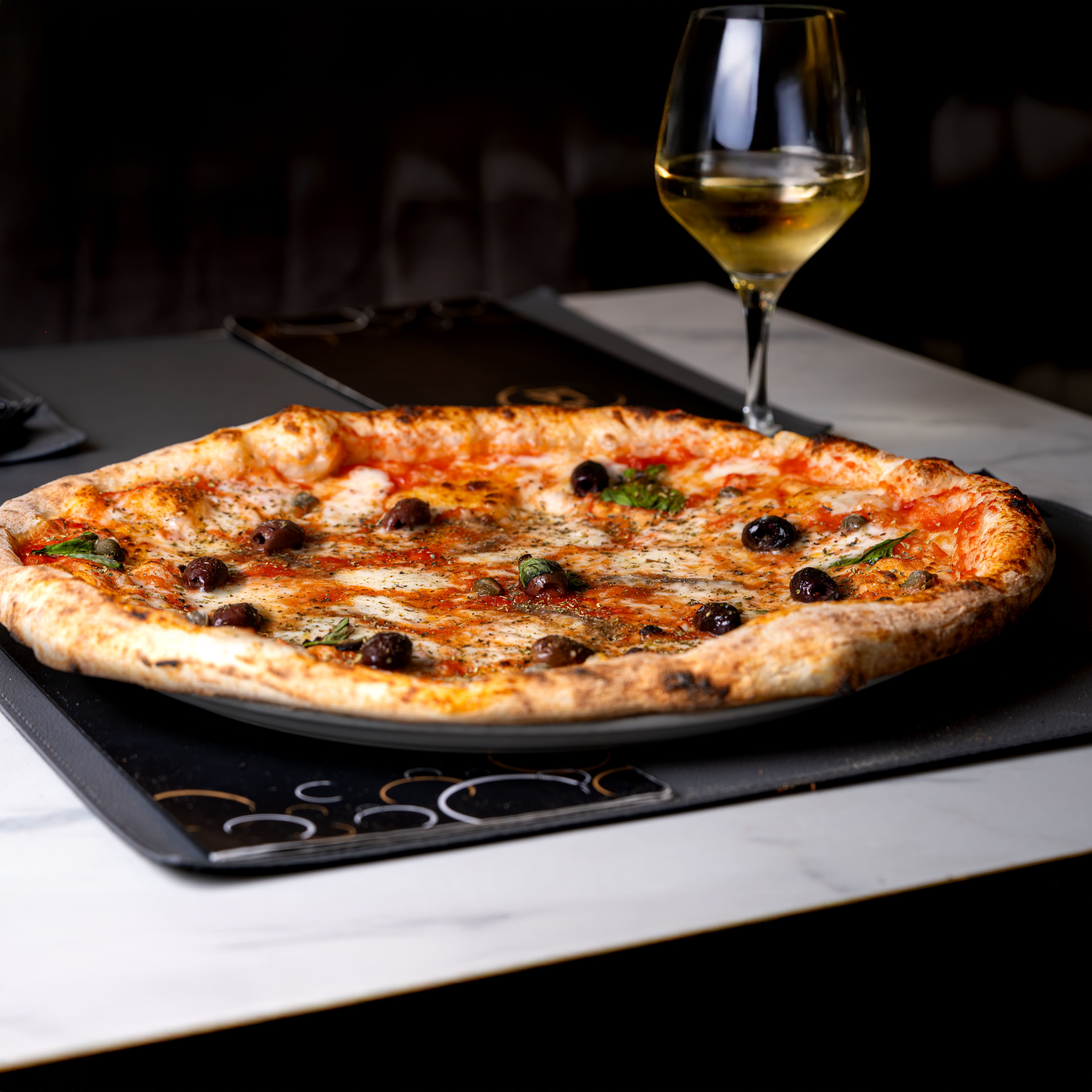 Gourmet Pizza and Wine on Marble Table · Free Stock Photo