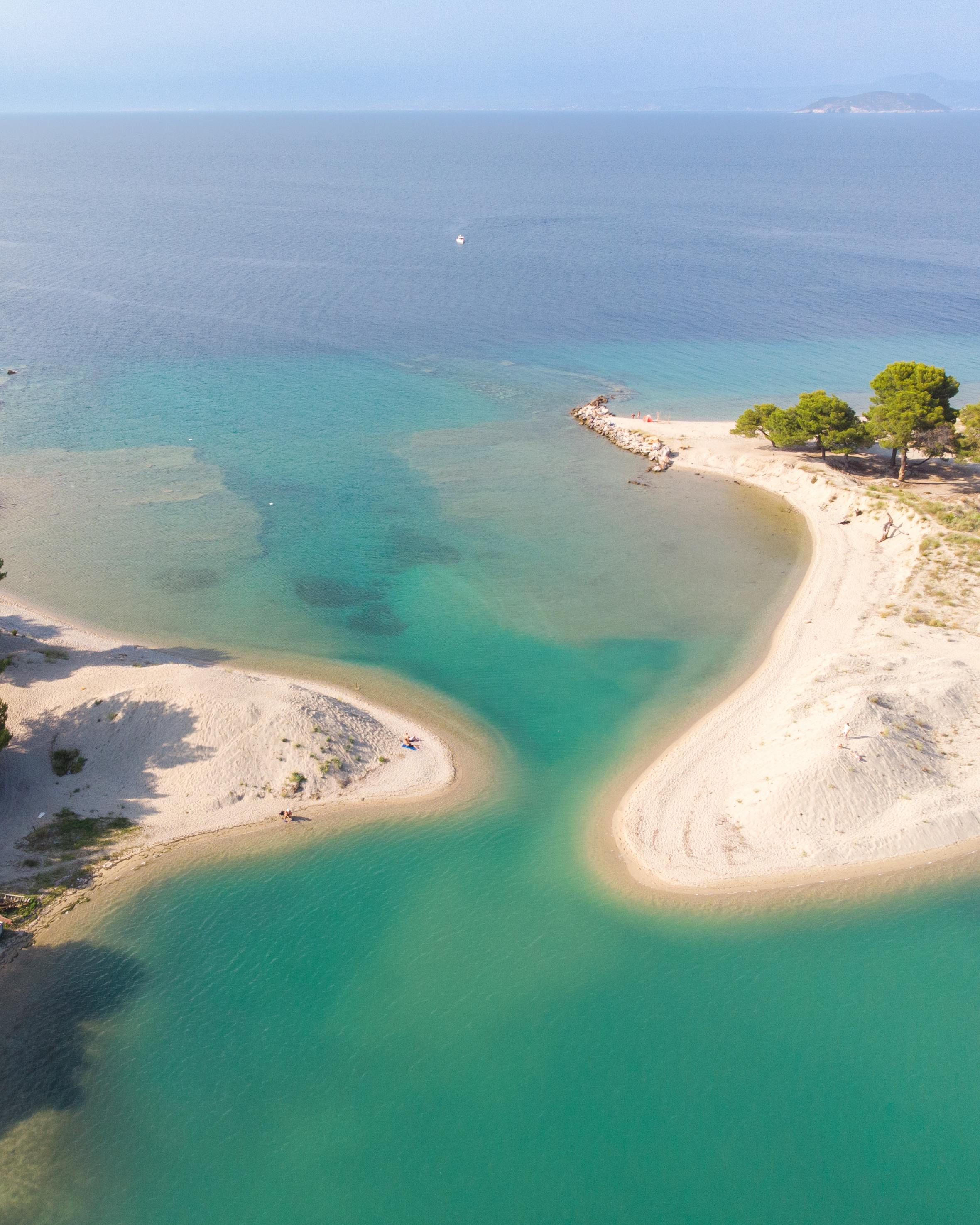 Aerial View of Pristine Greek Beach and Turquoise Waters · Free Stock Photo
