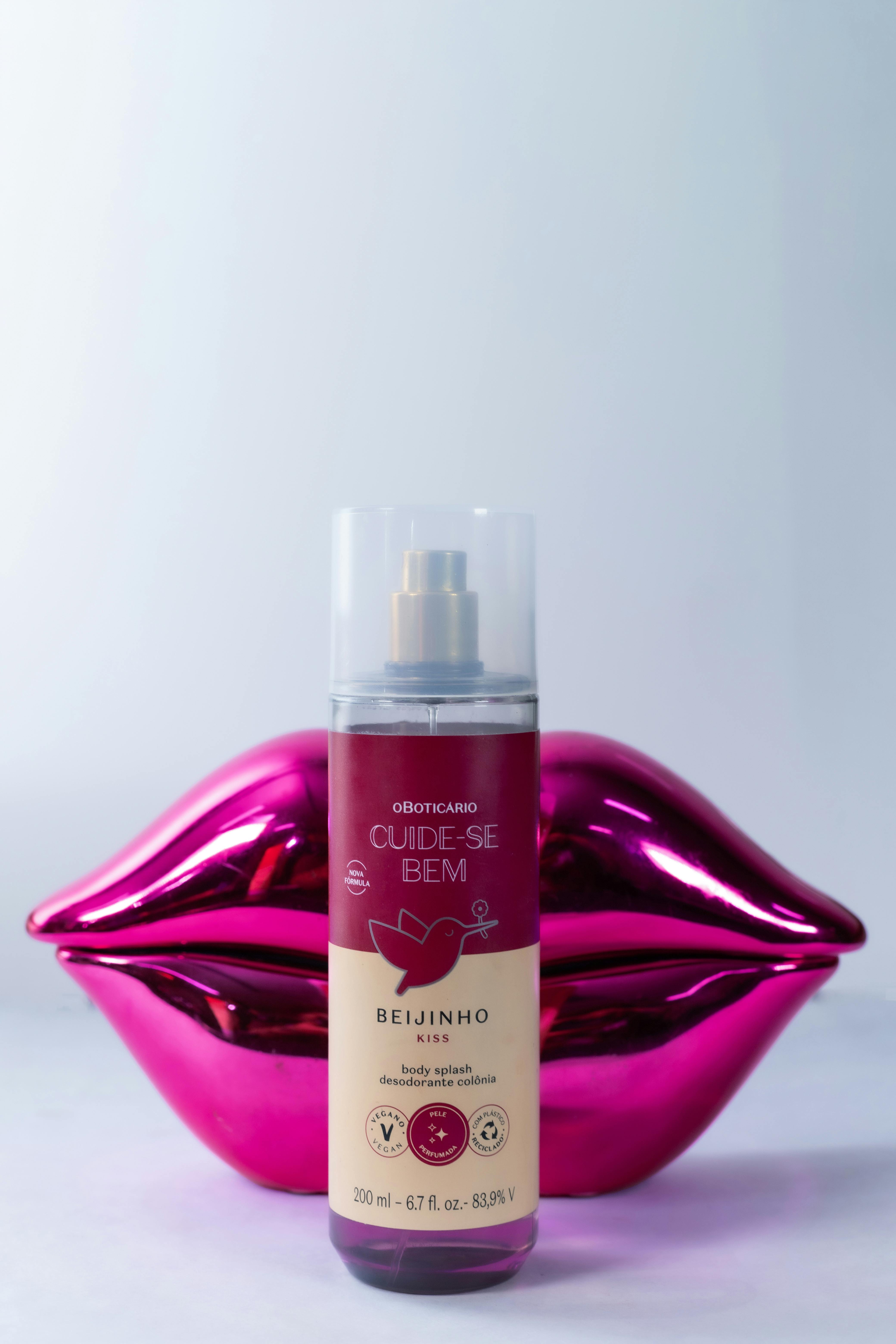 Vibrant Pink Lip Decor with Perfume Bottle · Free Stock Photo