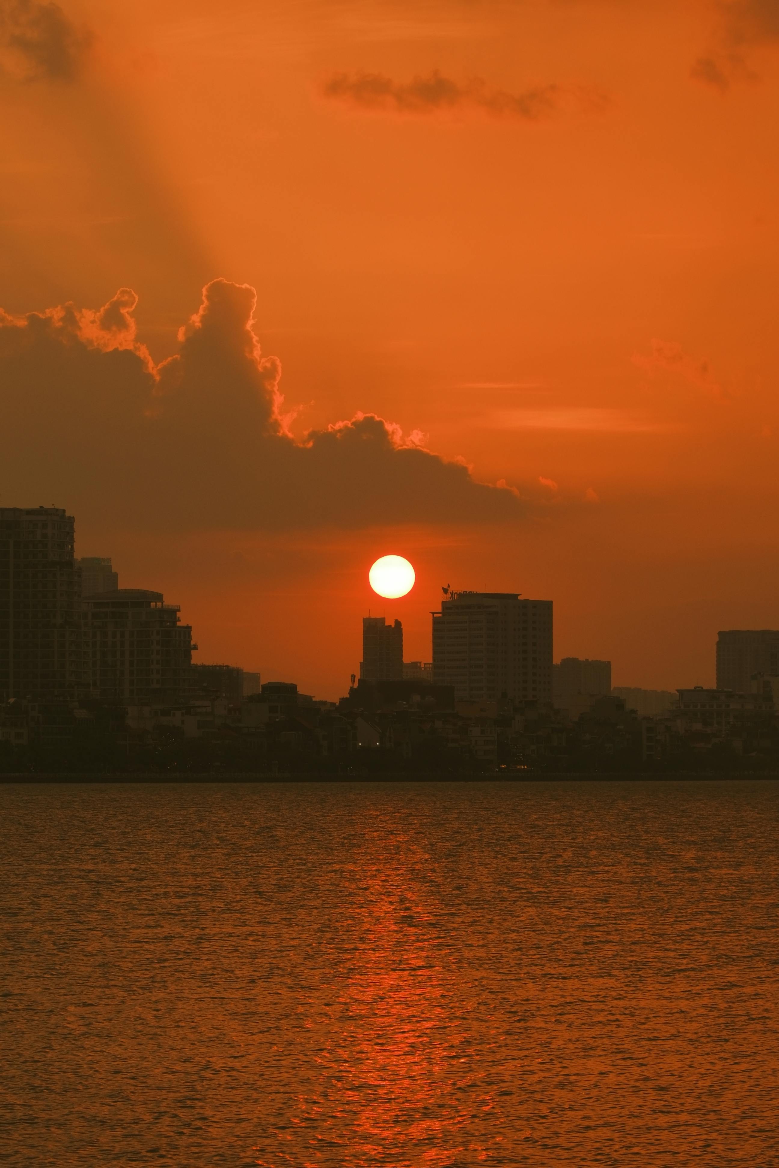 Captivating Hanoi Sunset Over the City Skyline · Free Stock Photo