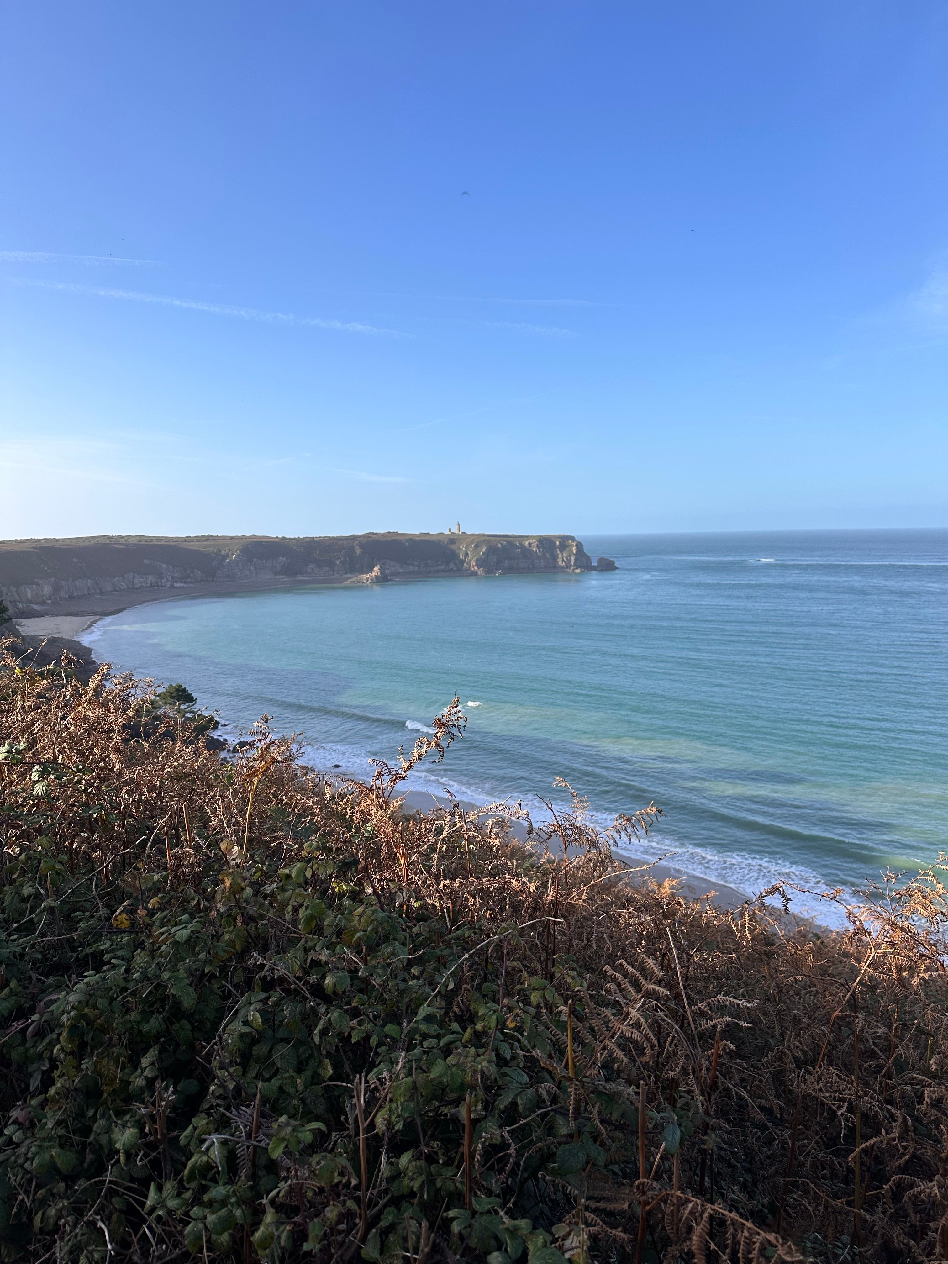 Coastal Cliffs and Ocean View Under Blue Sky · Free Stock Photo