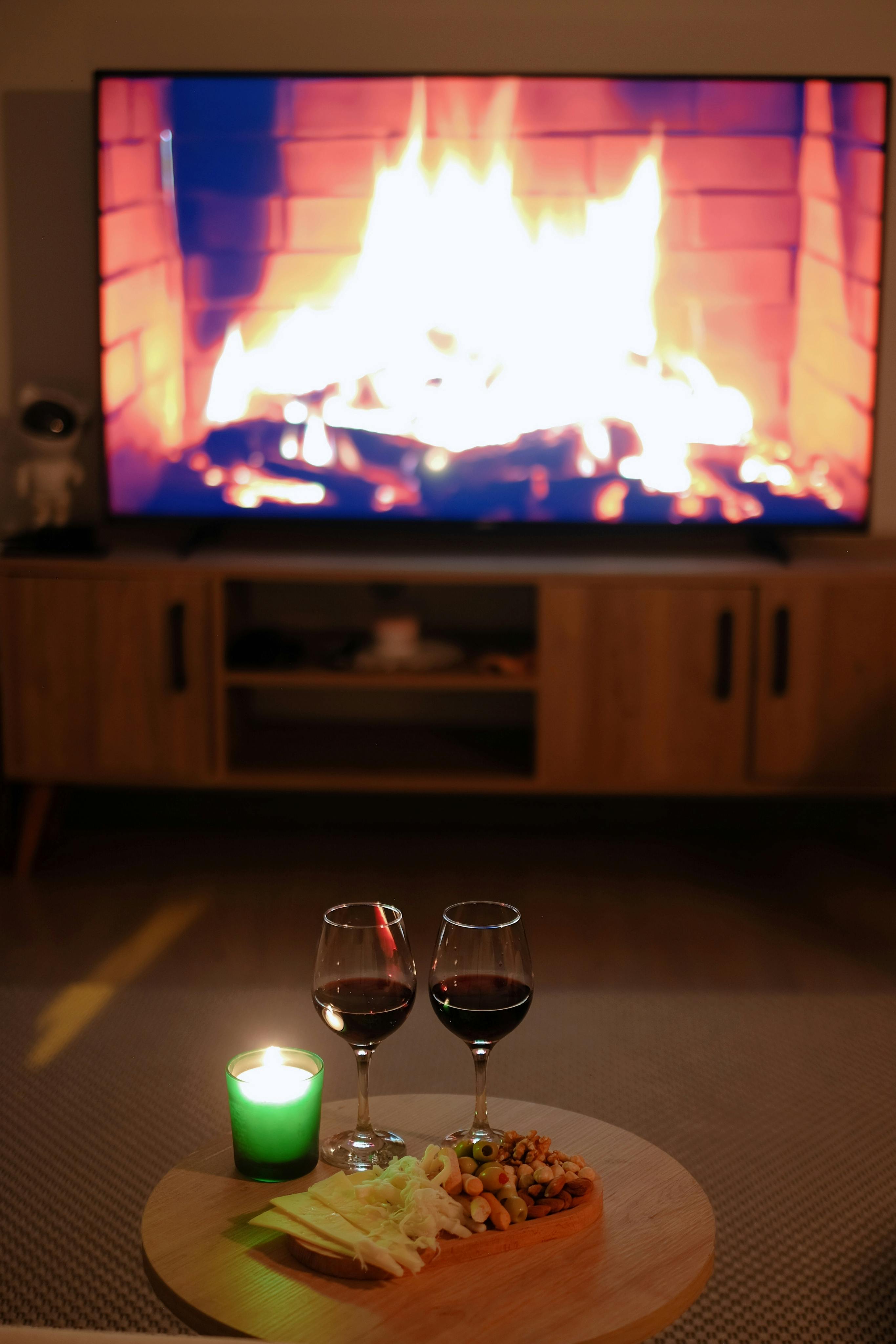 Cozy Night In with Wine and Fireplace · Free Stock Photo