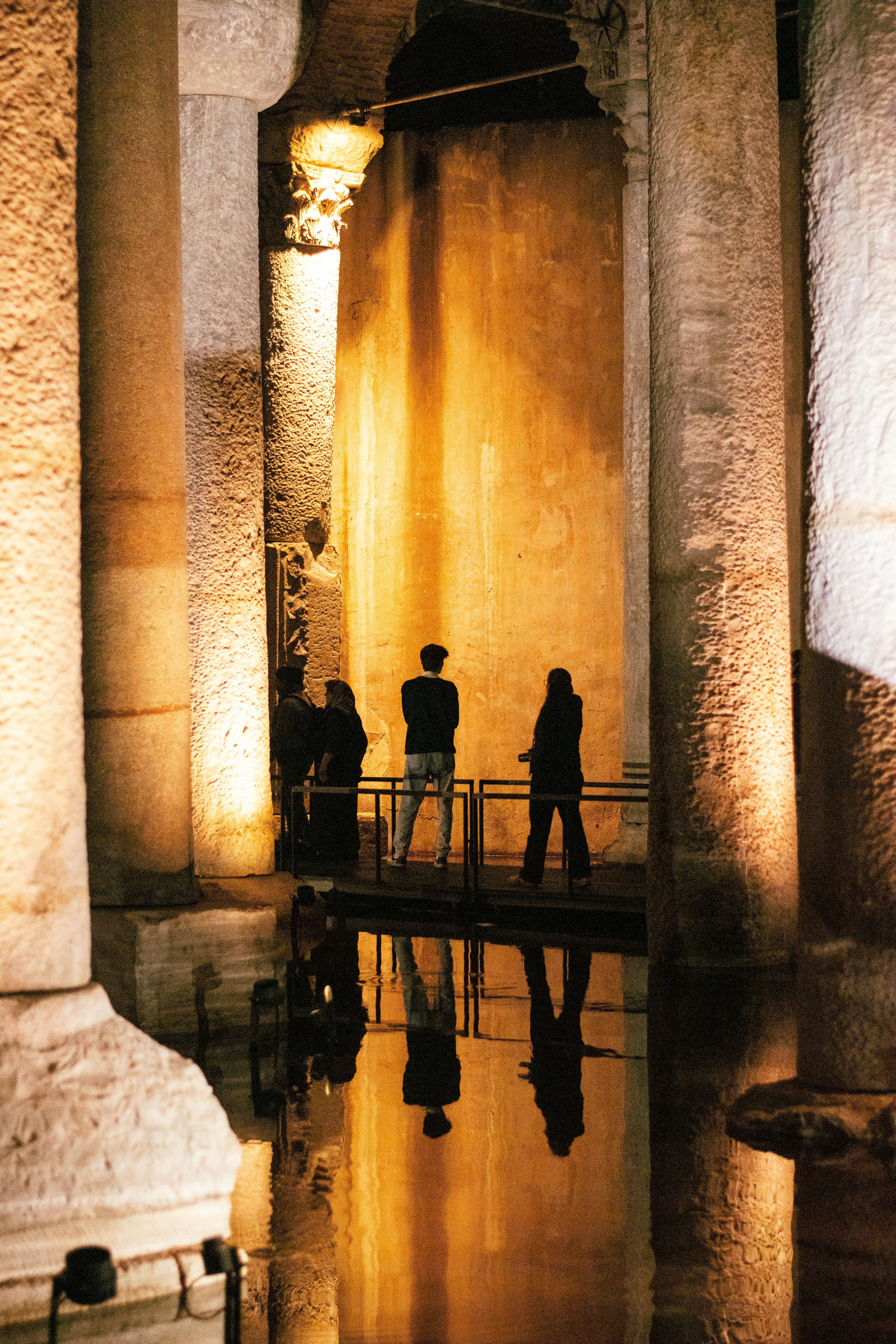 Visitors Explore the Basilica Cistern in Evening Light · Free Stock Photo