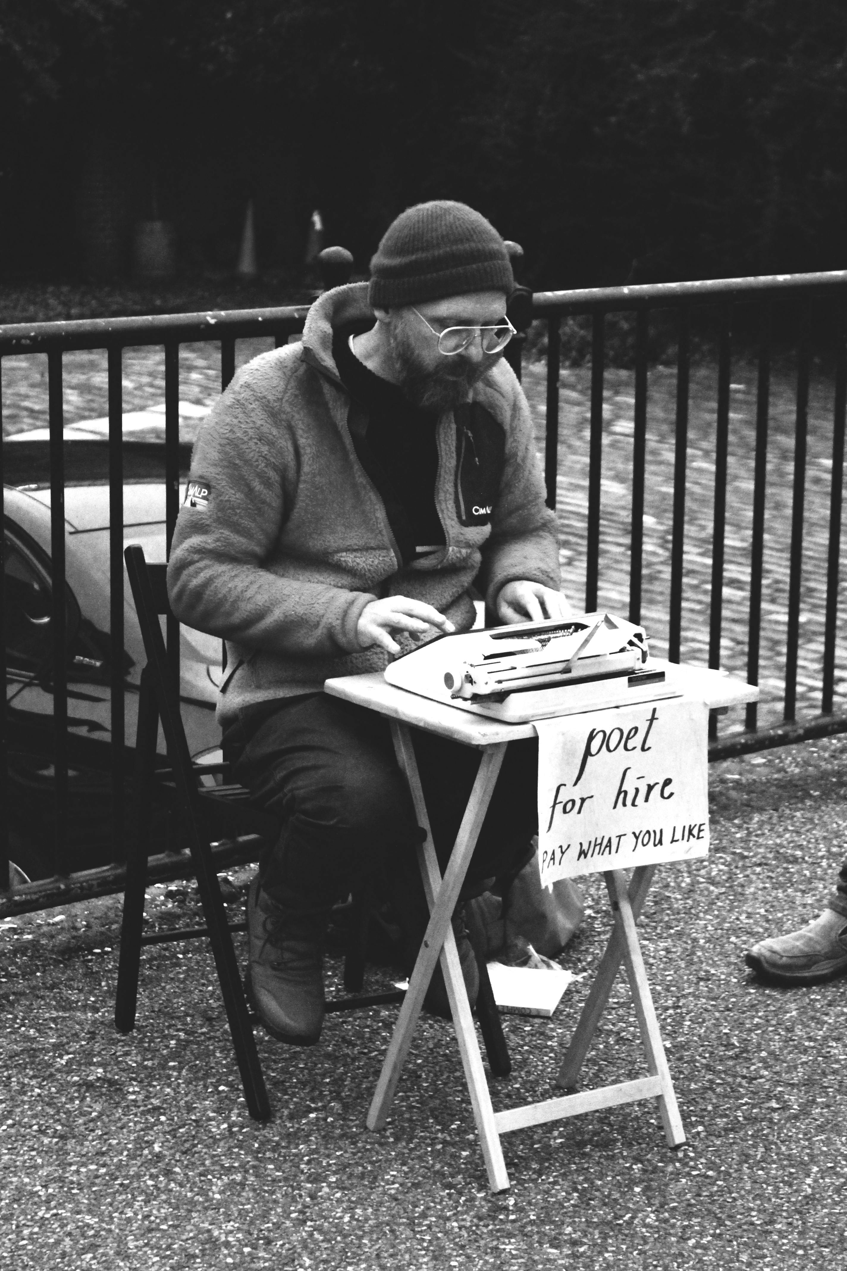 Street Poet Typing in London's Park · Free Stock Photo