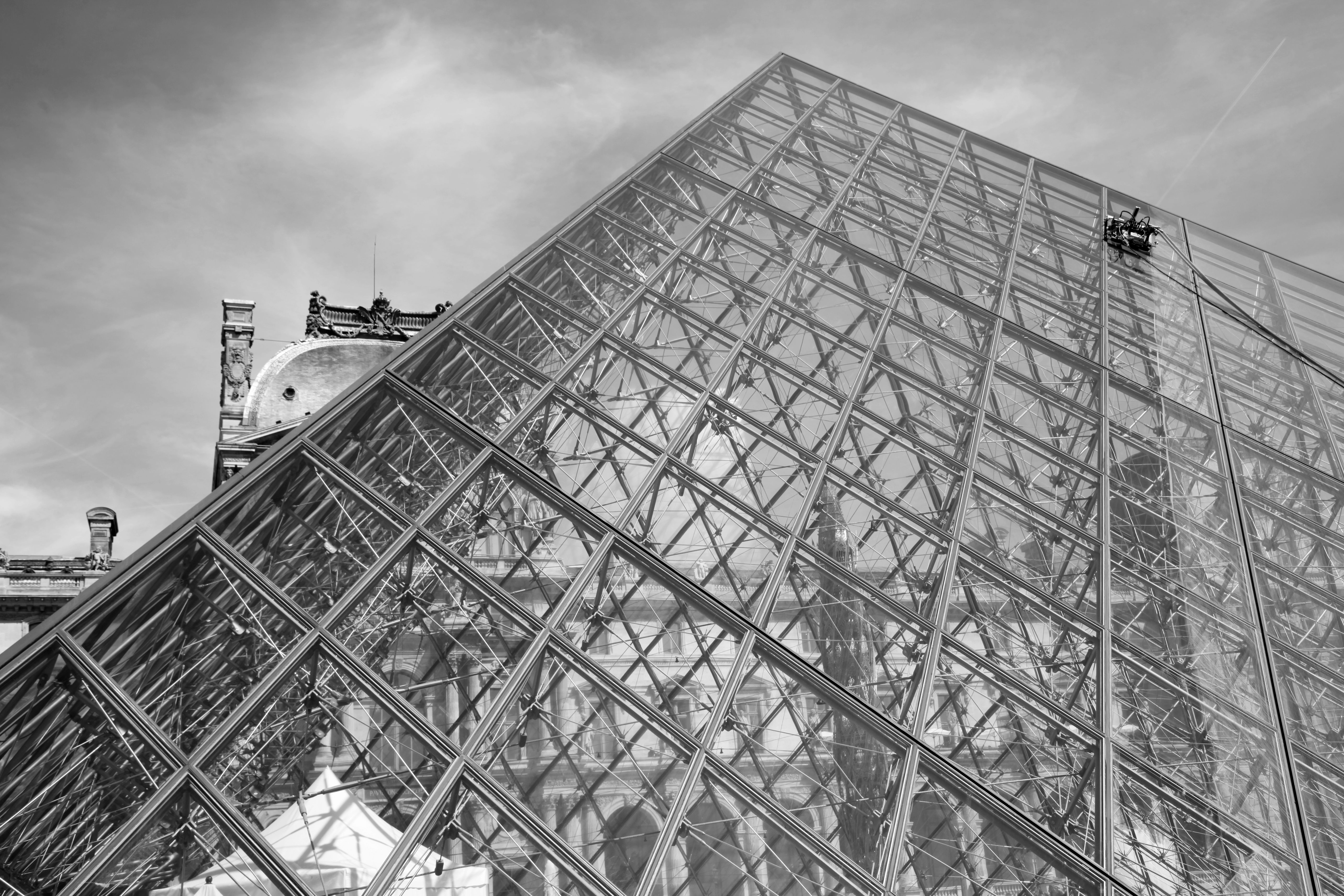 Louvre Pyramid Architectural Close-Up in Paris · Free Stock Photo