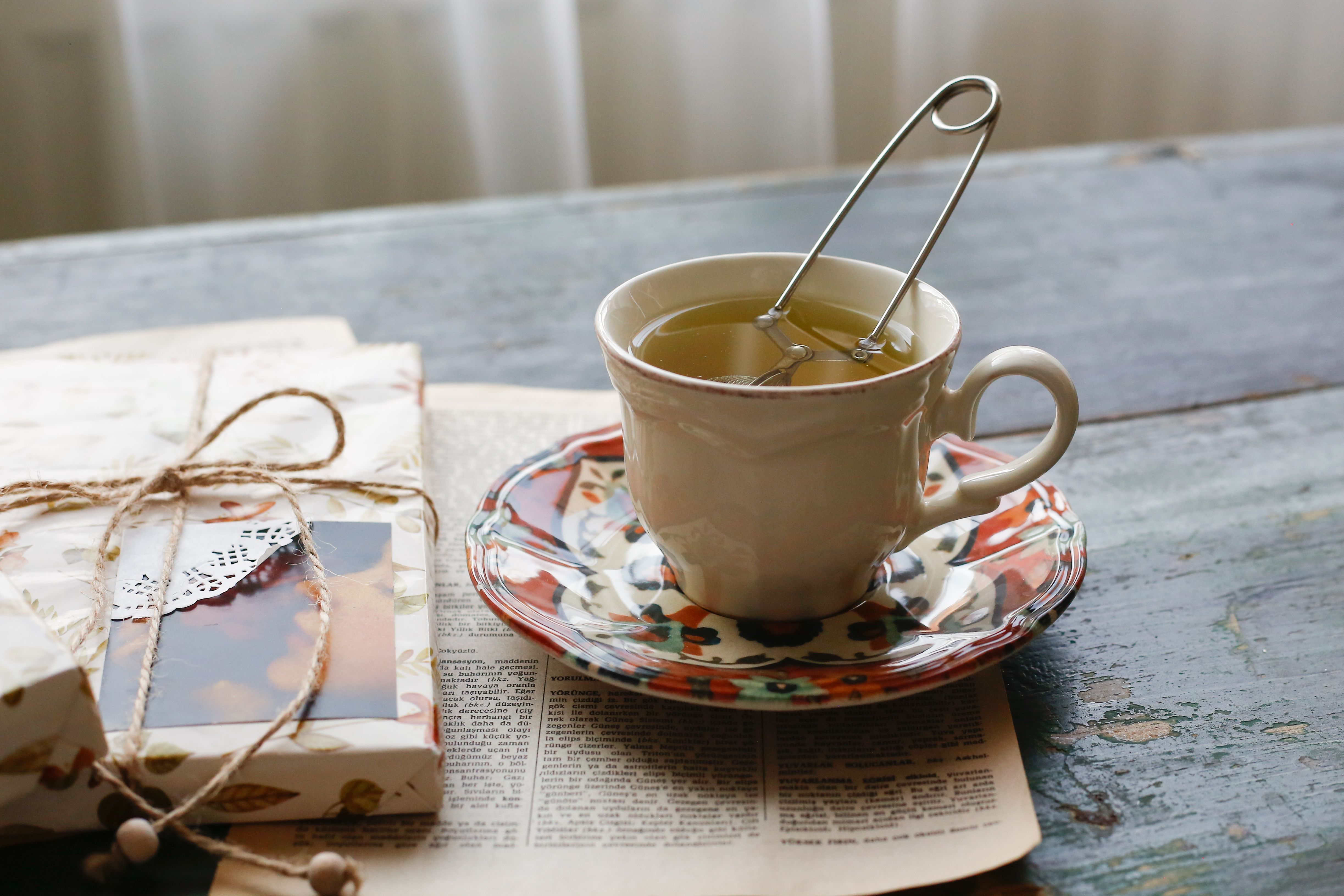 Cozy Tea Time with Floral Teacup and Books · Free Stock Photo