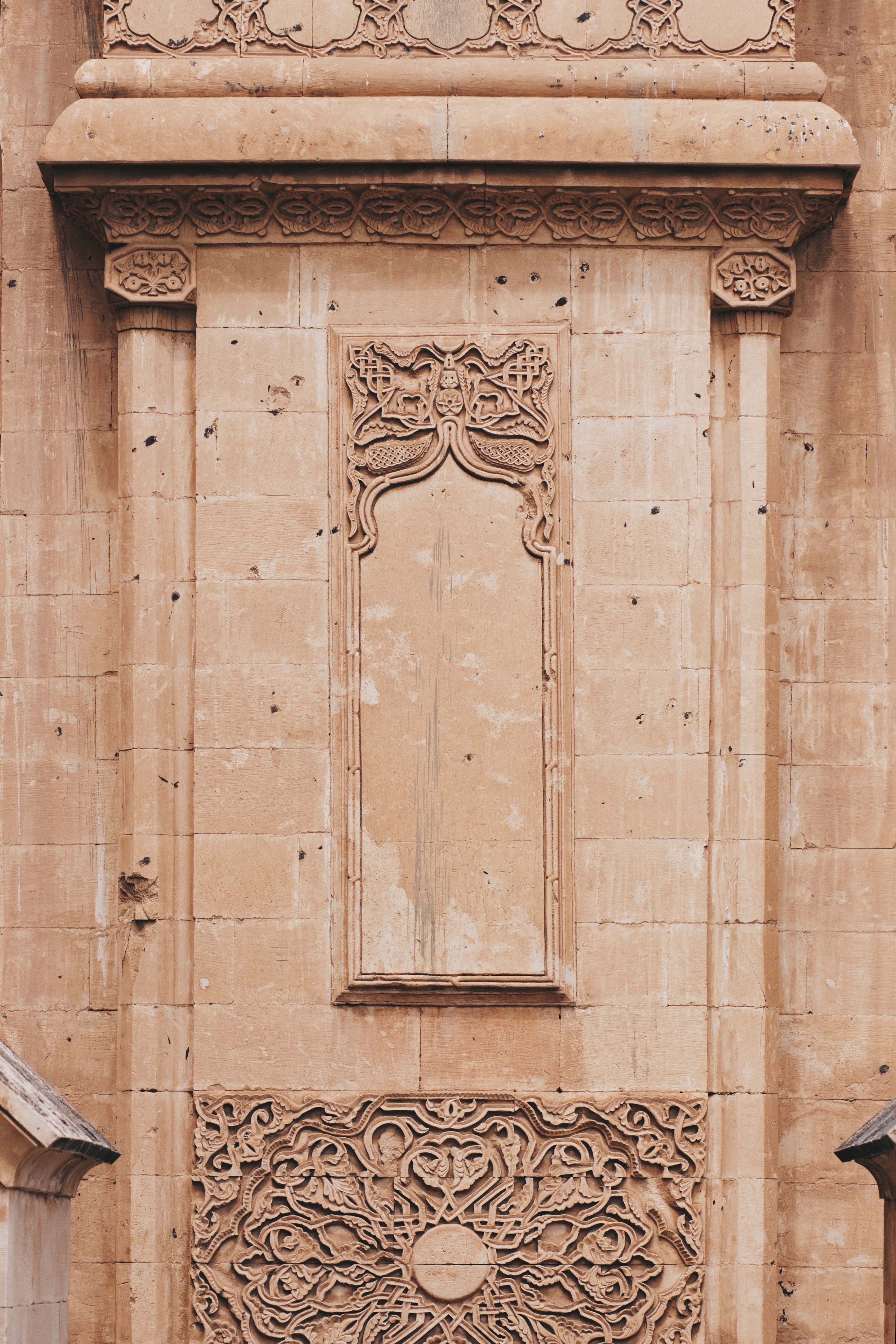 Ornate Architectural Wall with Intricate Carvings · Free Stock Photo