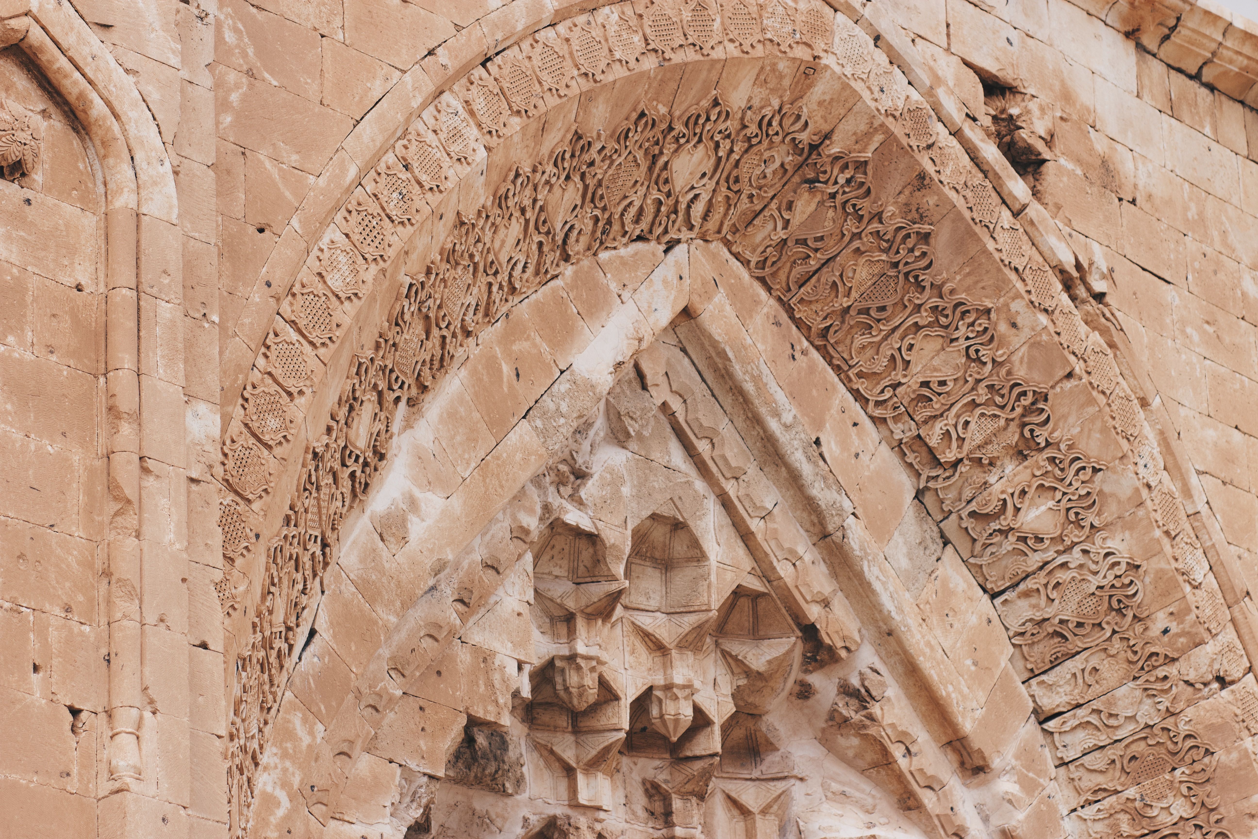Intricate Stone Carvings on Historic Archway · Free Stock Photo