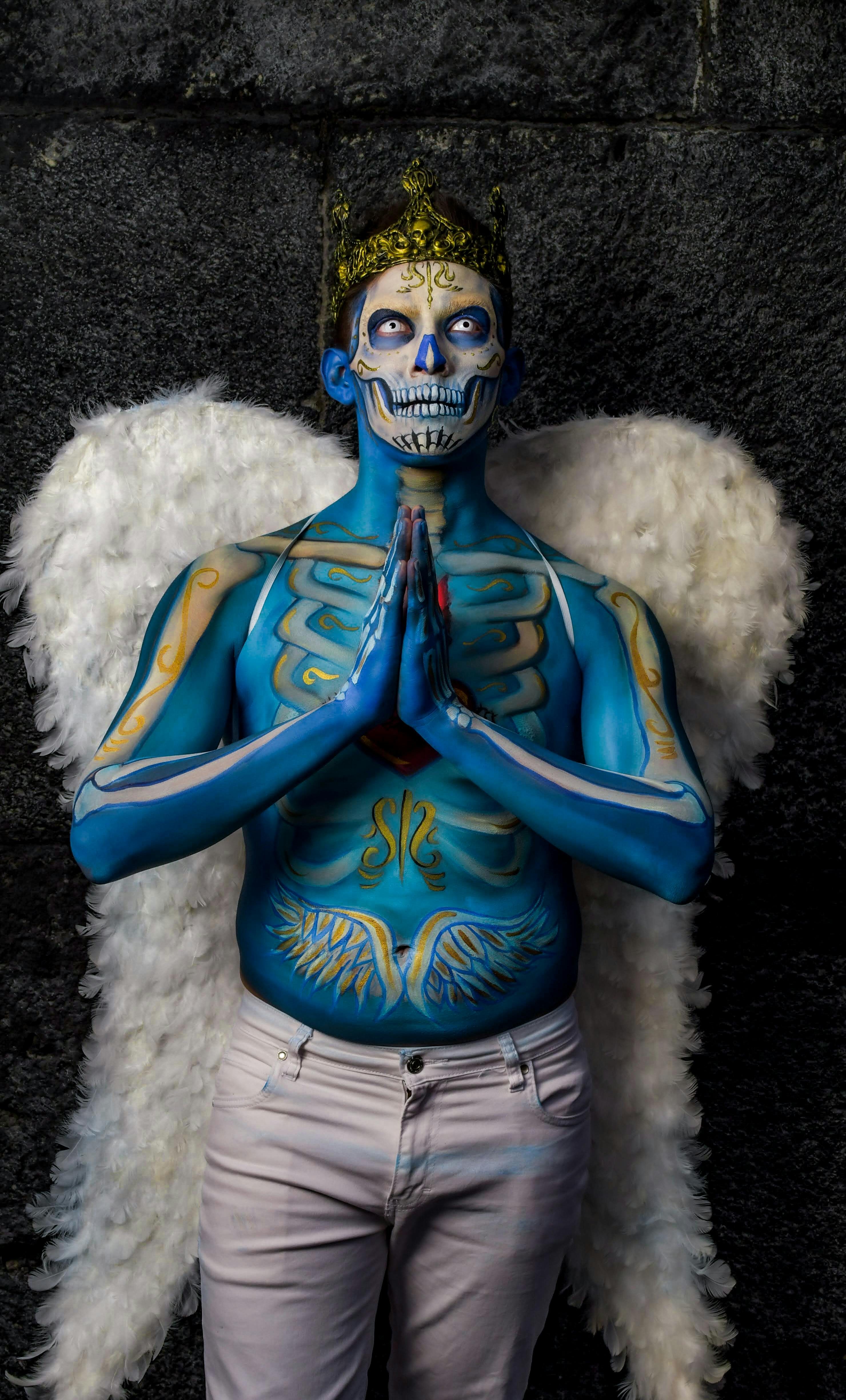 Vibrant Body Paint with Angelic Wings and Crown · Free Stock Photo