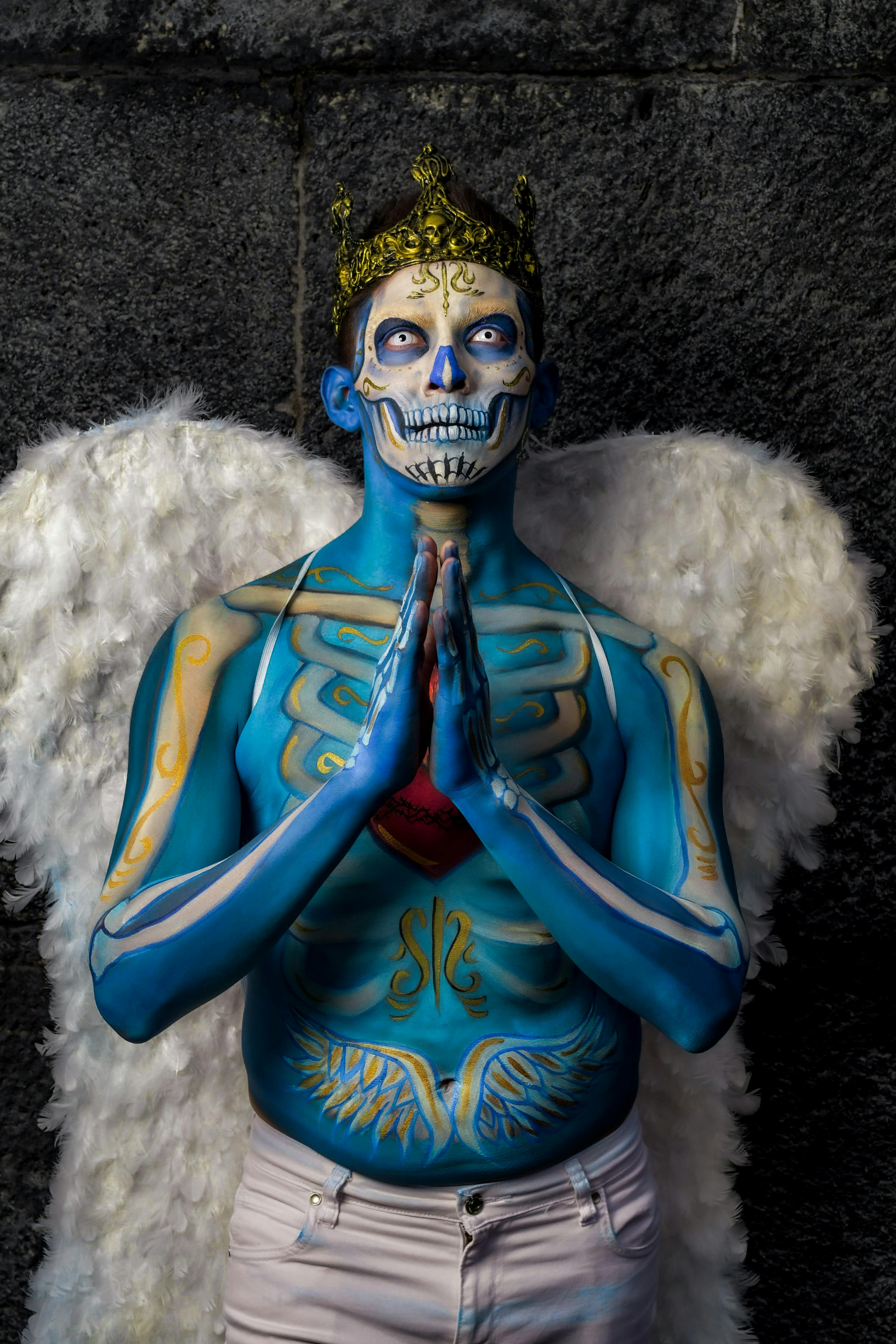 Vibrant Skeleton Body Paint with Wings and Crown · Free Stock Photo
