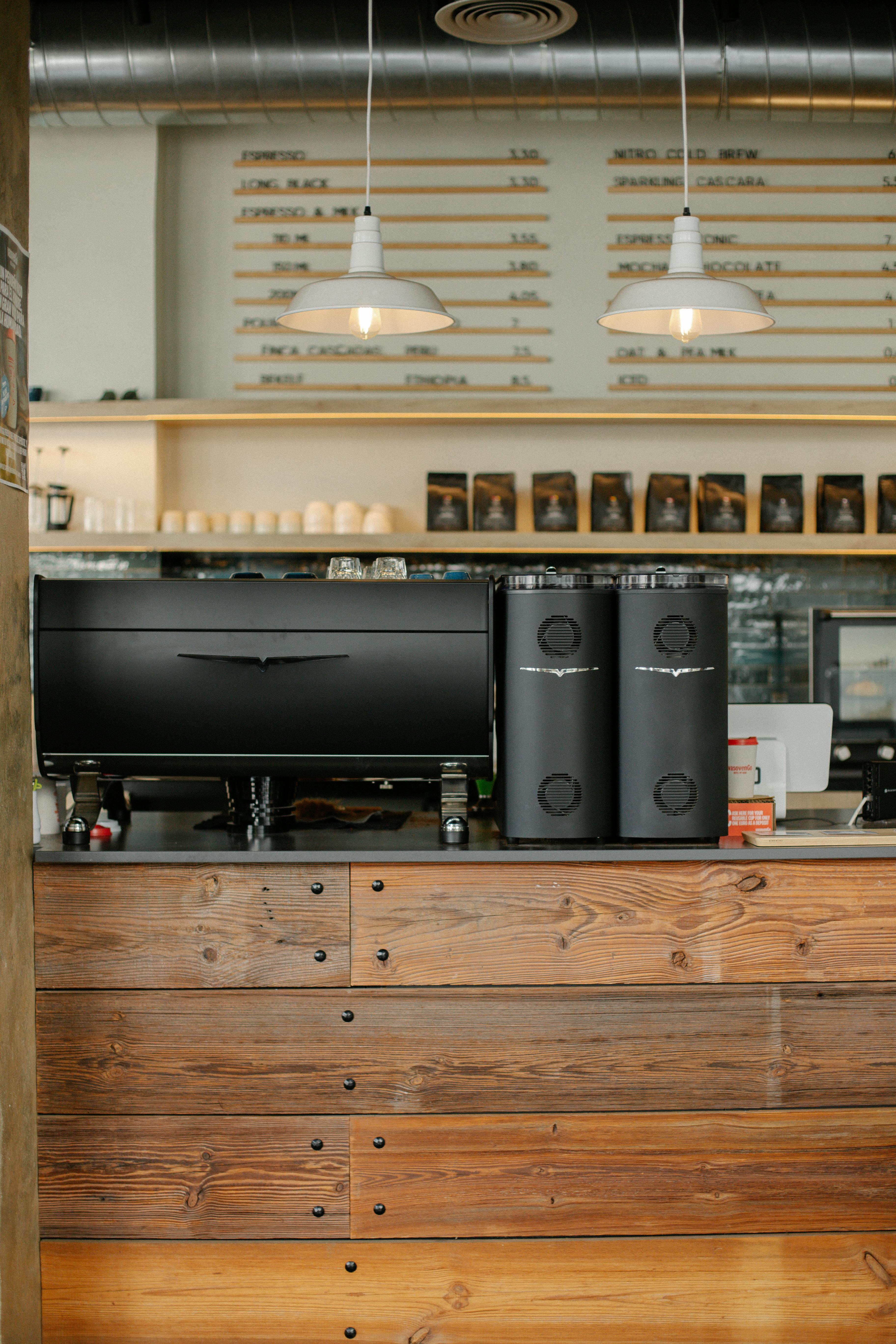 Cozy Modern Café Interior with Coffee Machine · Free Stock Photo