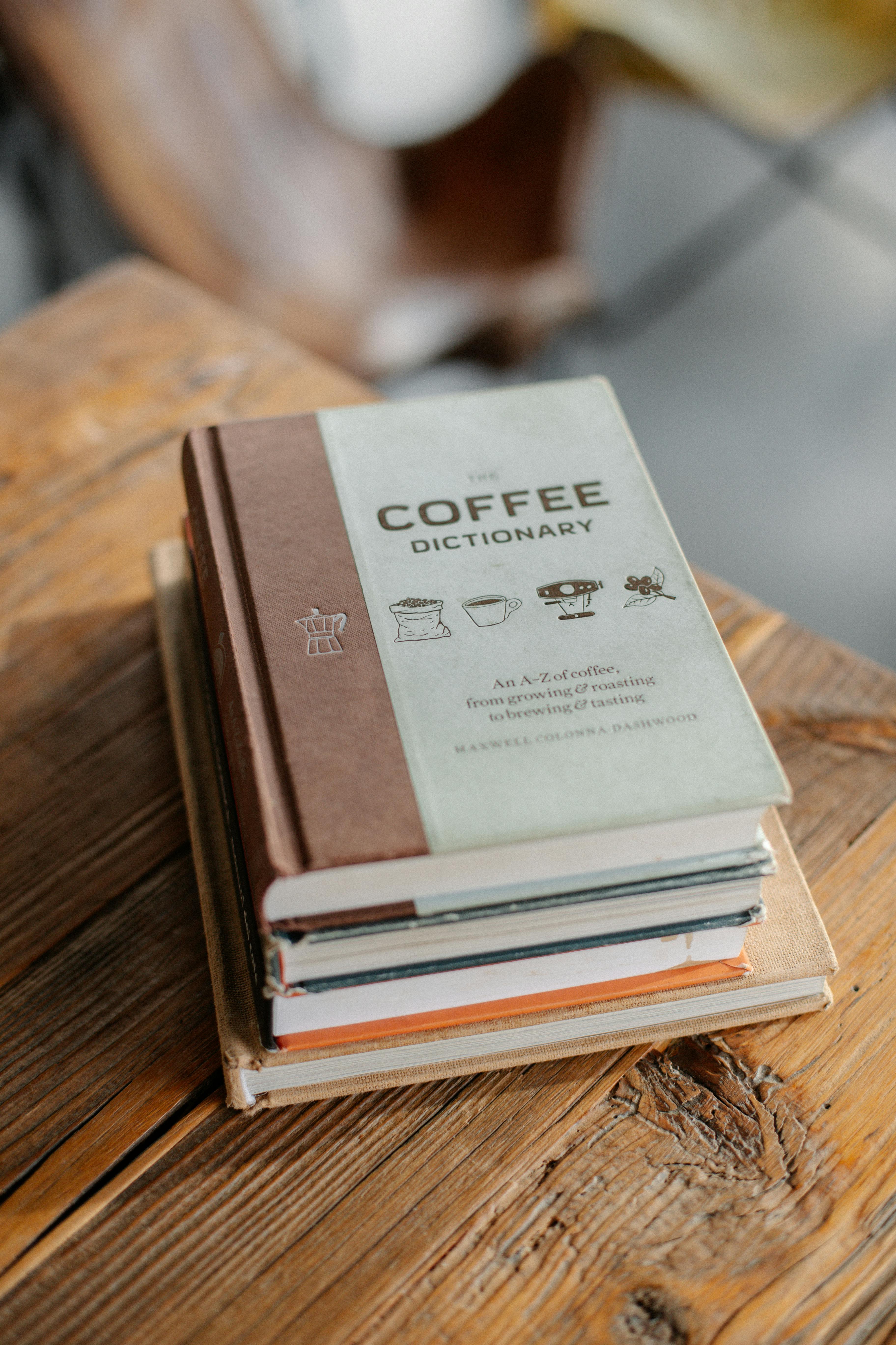 Stack of Books Featuring Coffee Dictionary · Free Stock Photo