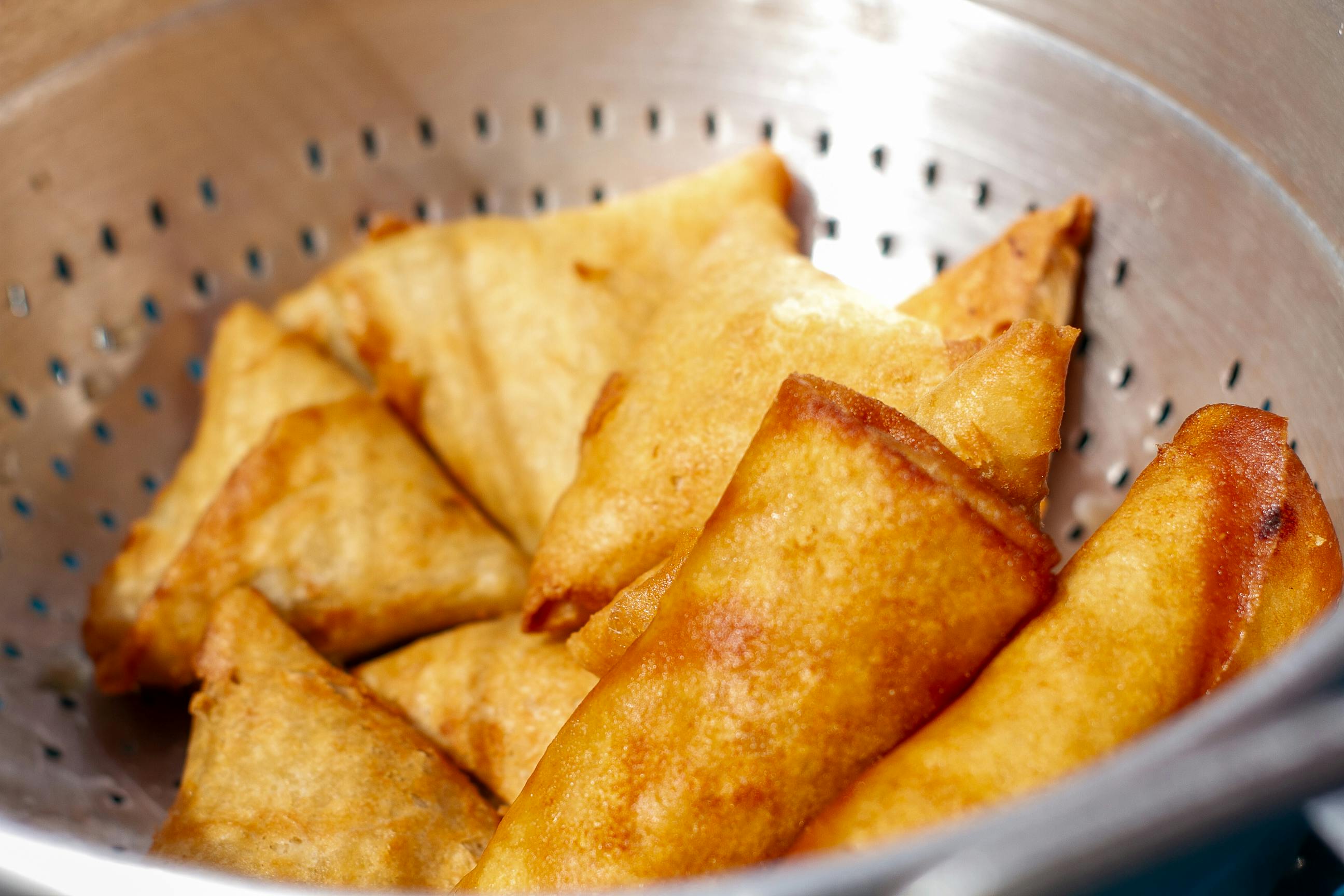 Crispy Fried Samosas in Metal Colander · Free Stock Photo