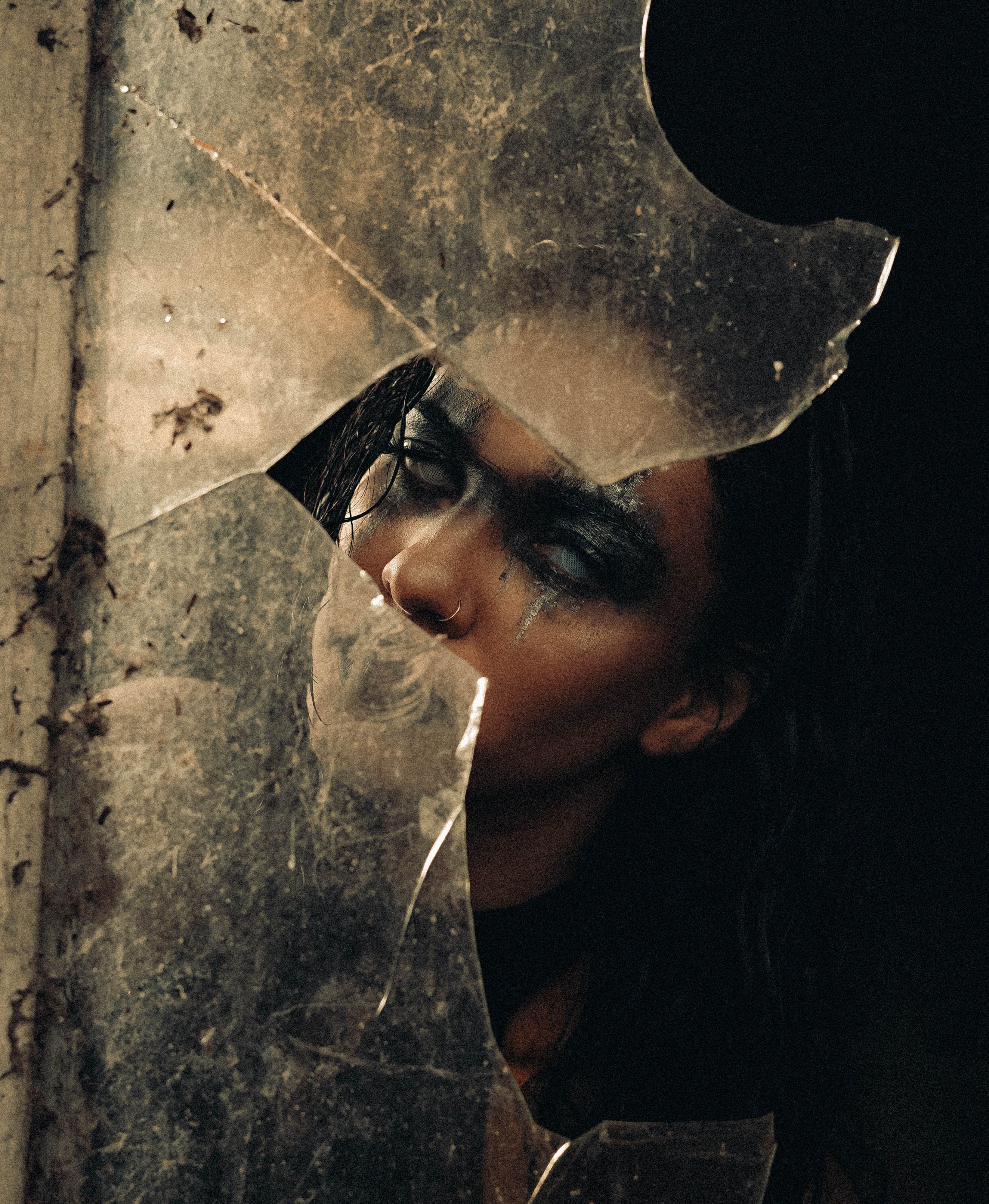 Dramatic Portrait Behind Breaking Glass · Free Stock Photo