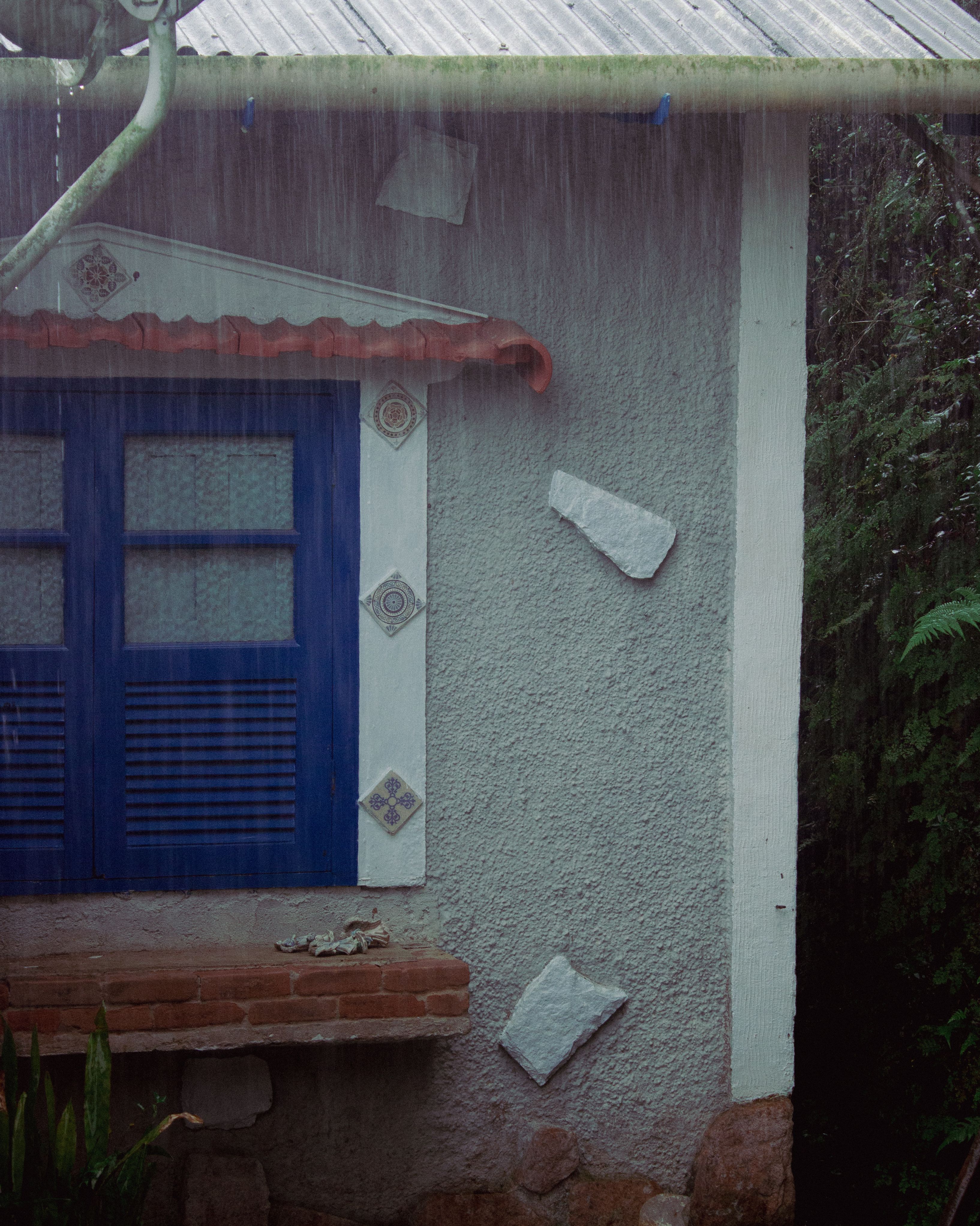 Charming House Facade in Rainy Weather · Free Stock Photo