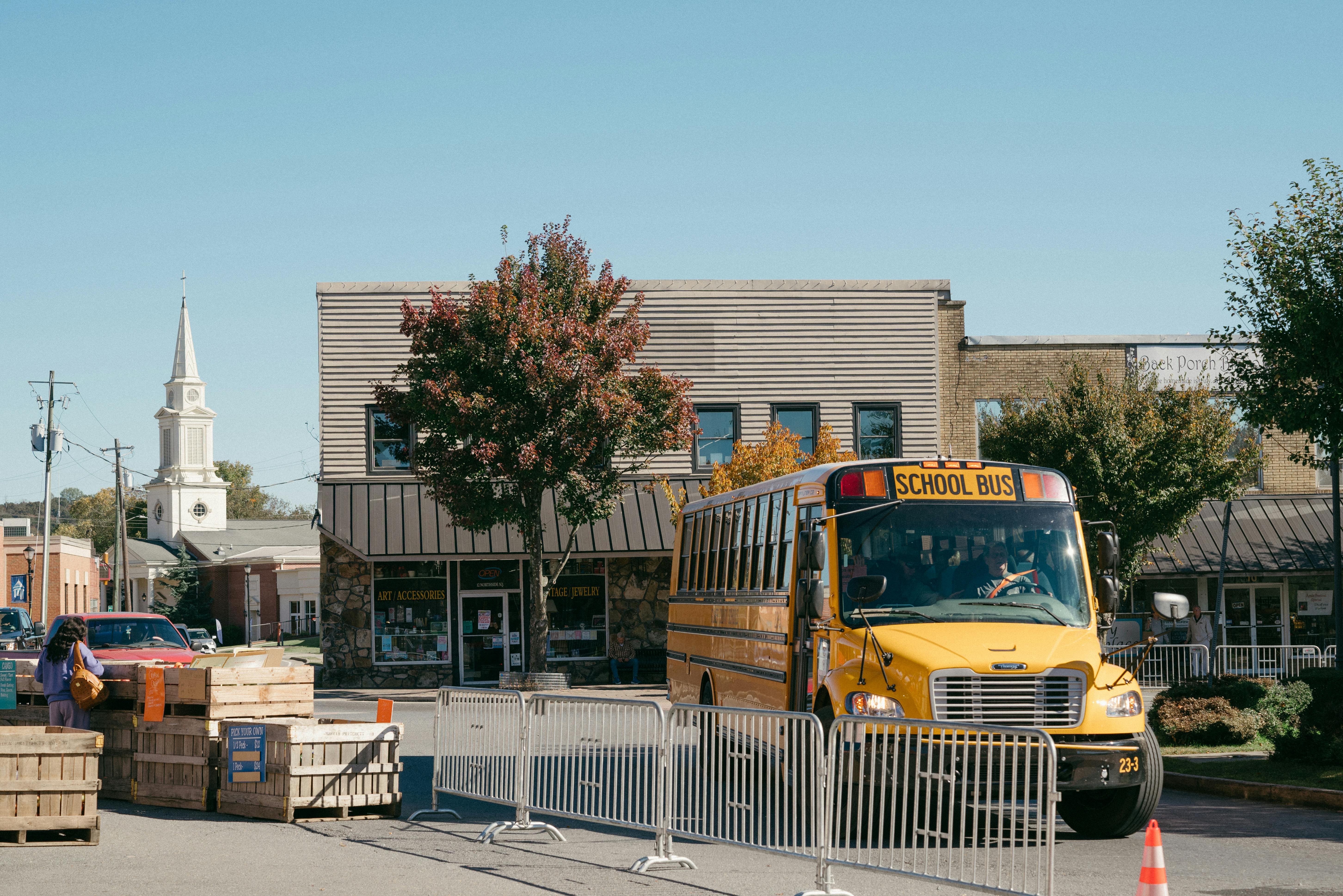 Small Town Street Scene with School Bus in Fall · Free Stock Photo
