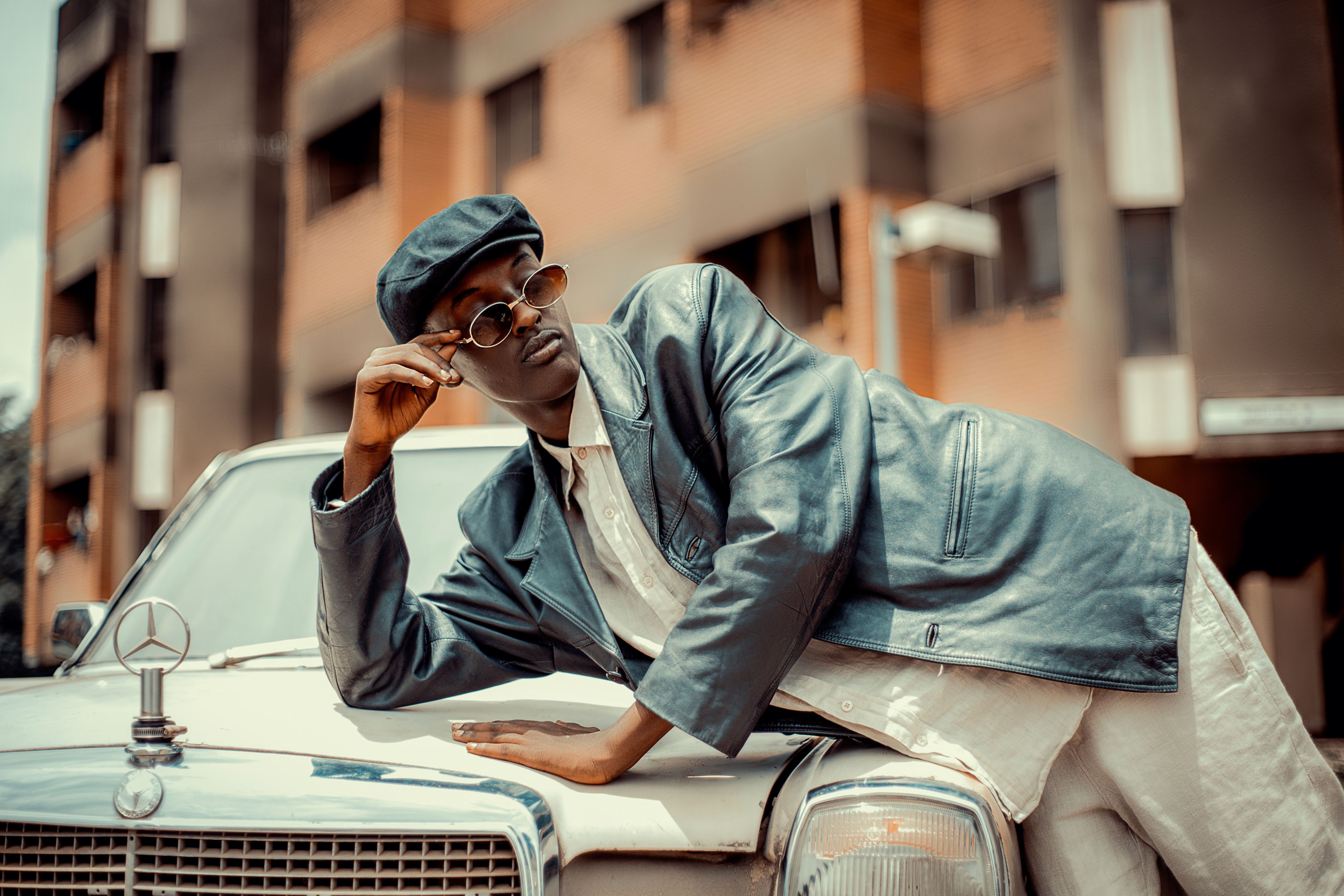 Stylish Individual Posing with Classic Car · Free Stock Photo