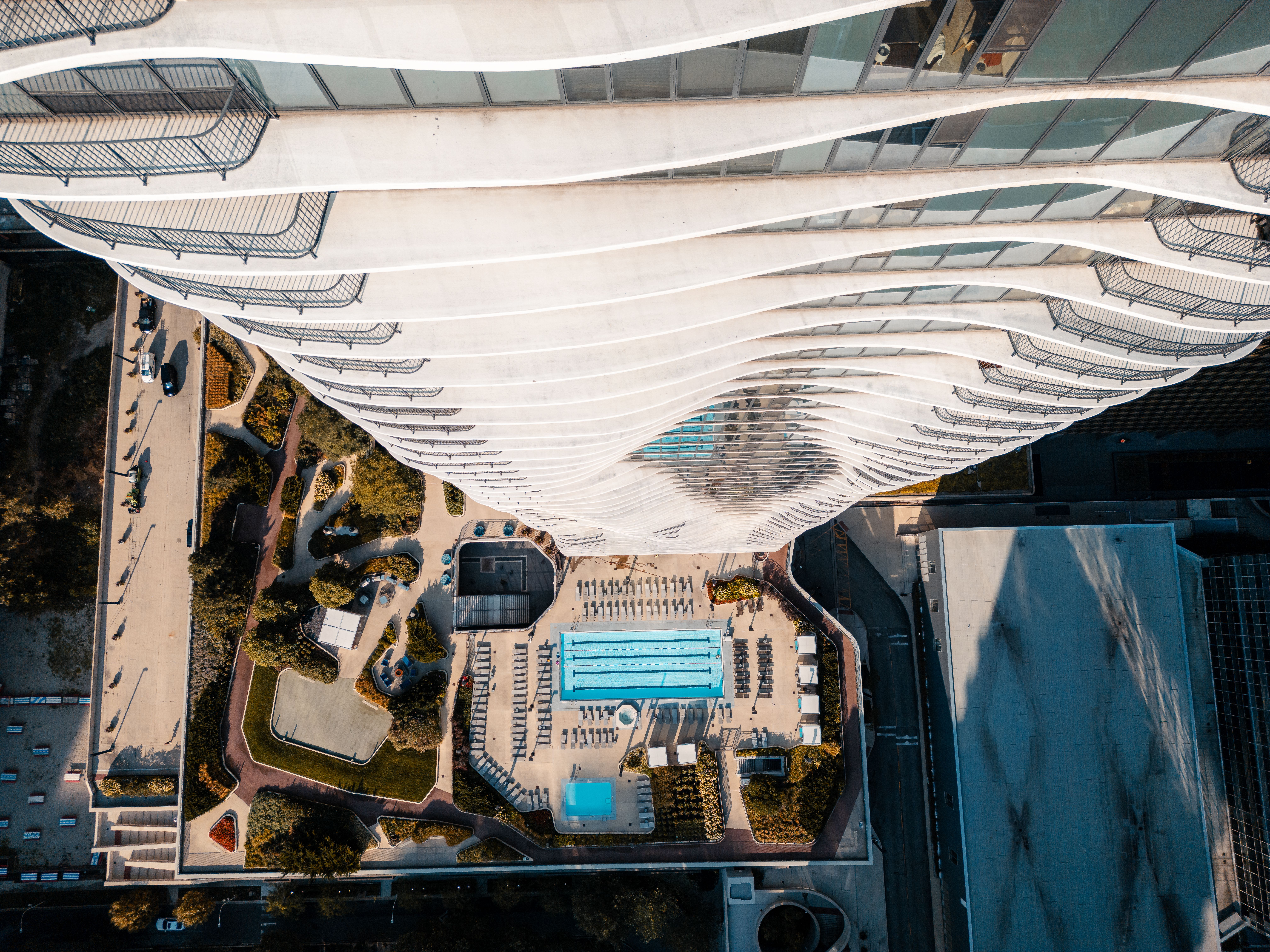Aerial View of Modern Skyscraper with Pool Terrace · Free Stock Photo