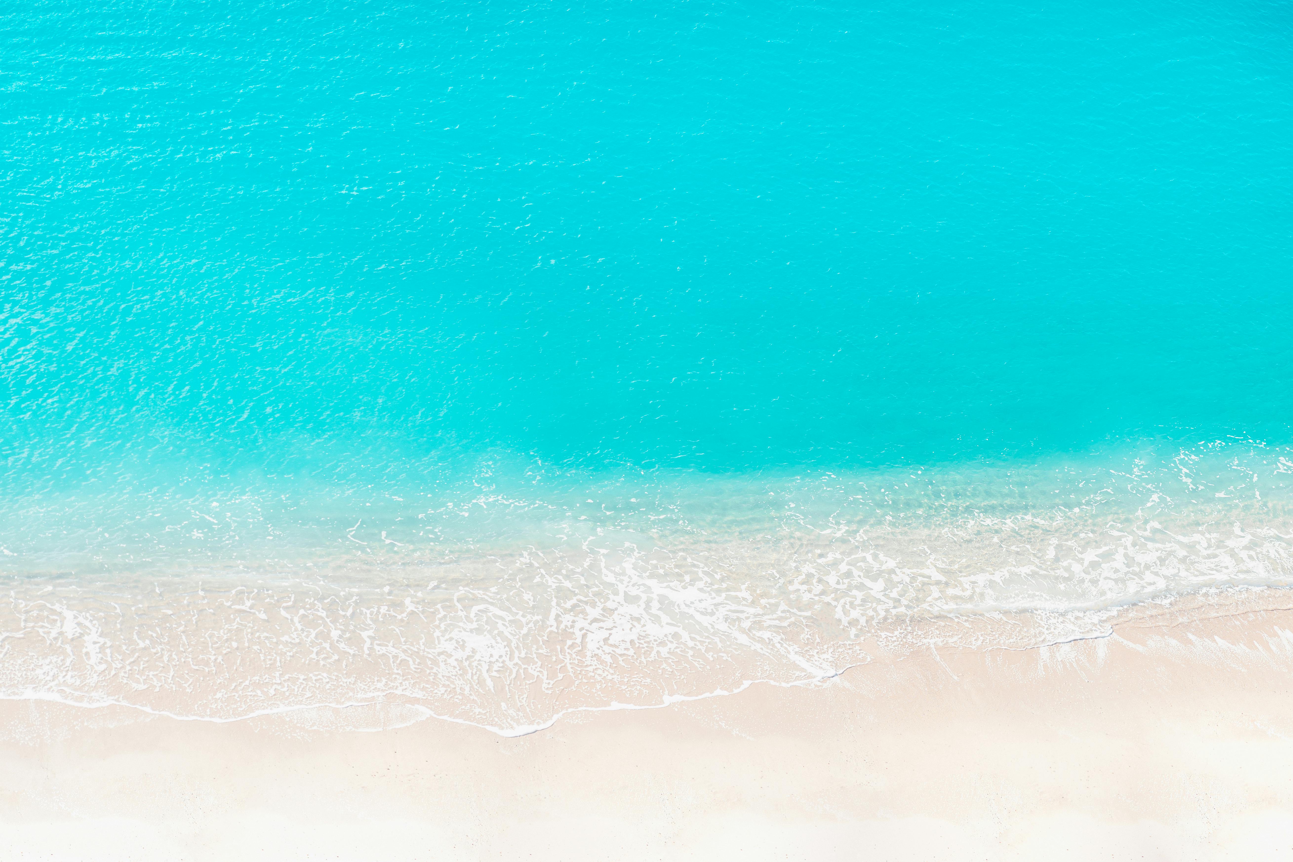 Aerial View of Turquoise Ocean Waves on Sandy Beach · Free Stock Photo