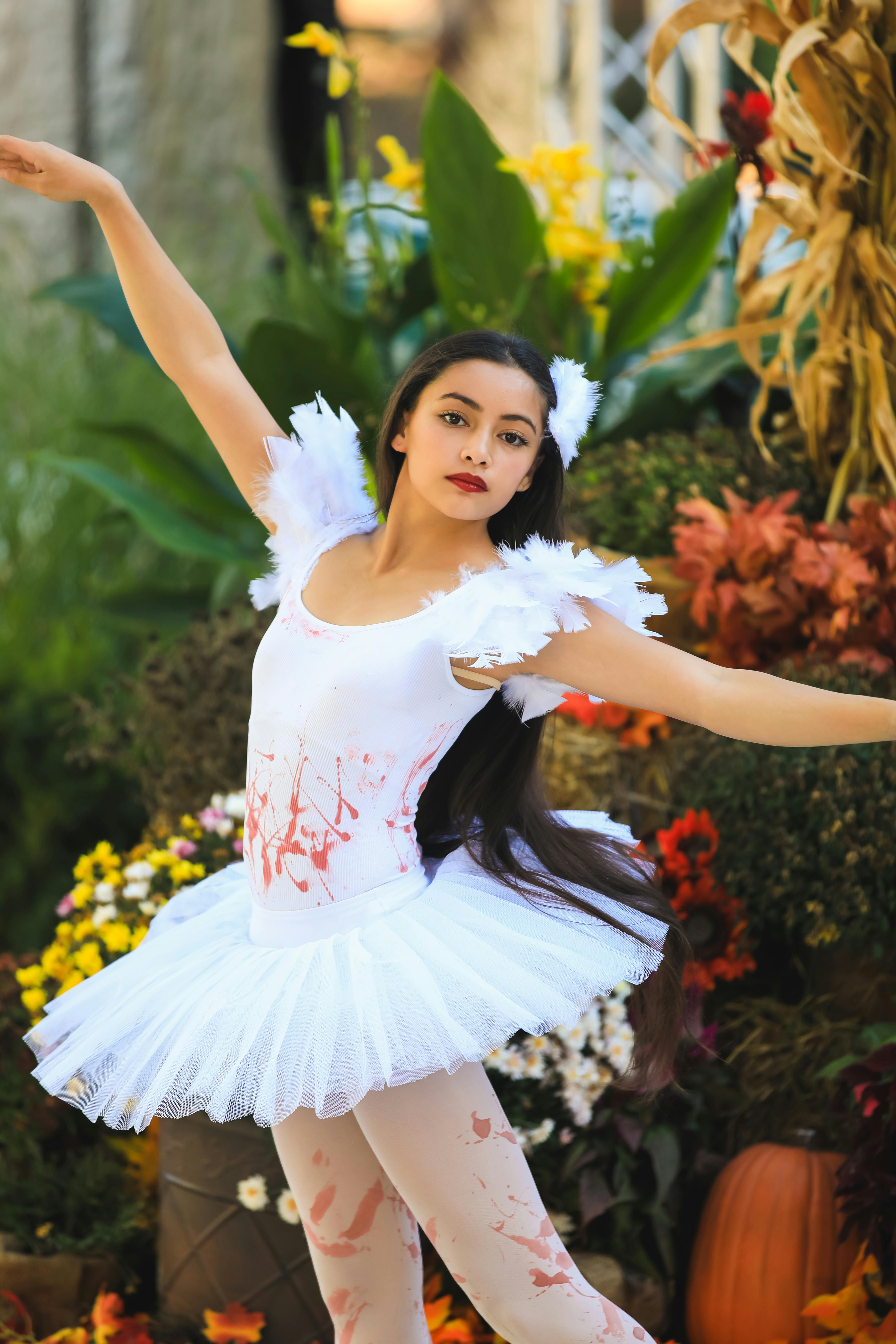 Ballet Dancer in Autumn Garden Setting · Free Stock Photo