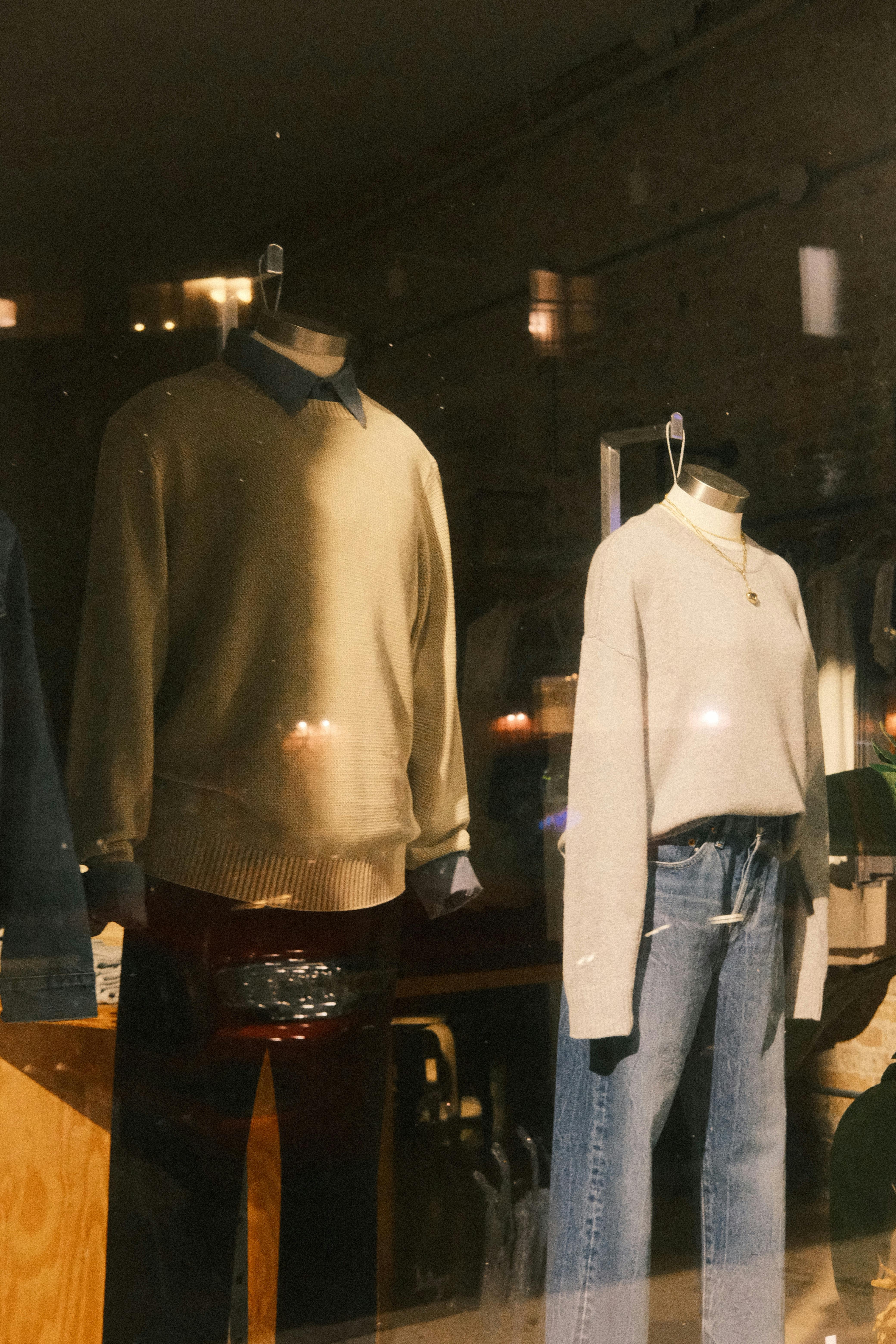 Chic Autumn Window Display with Sweaters · Free Stock Photo