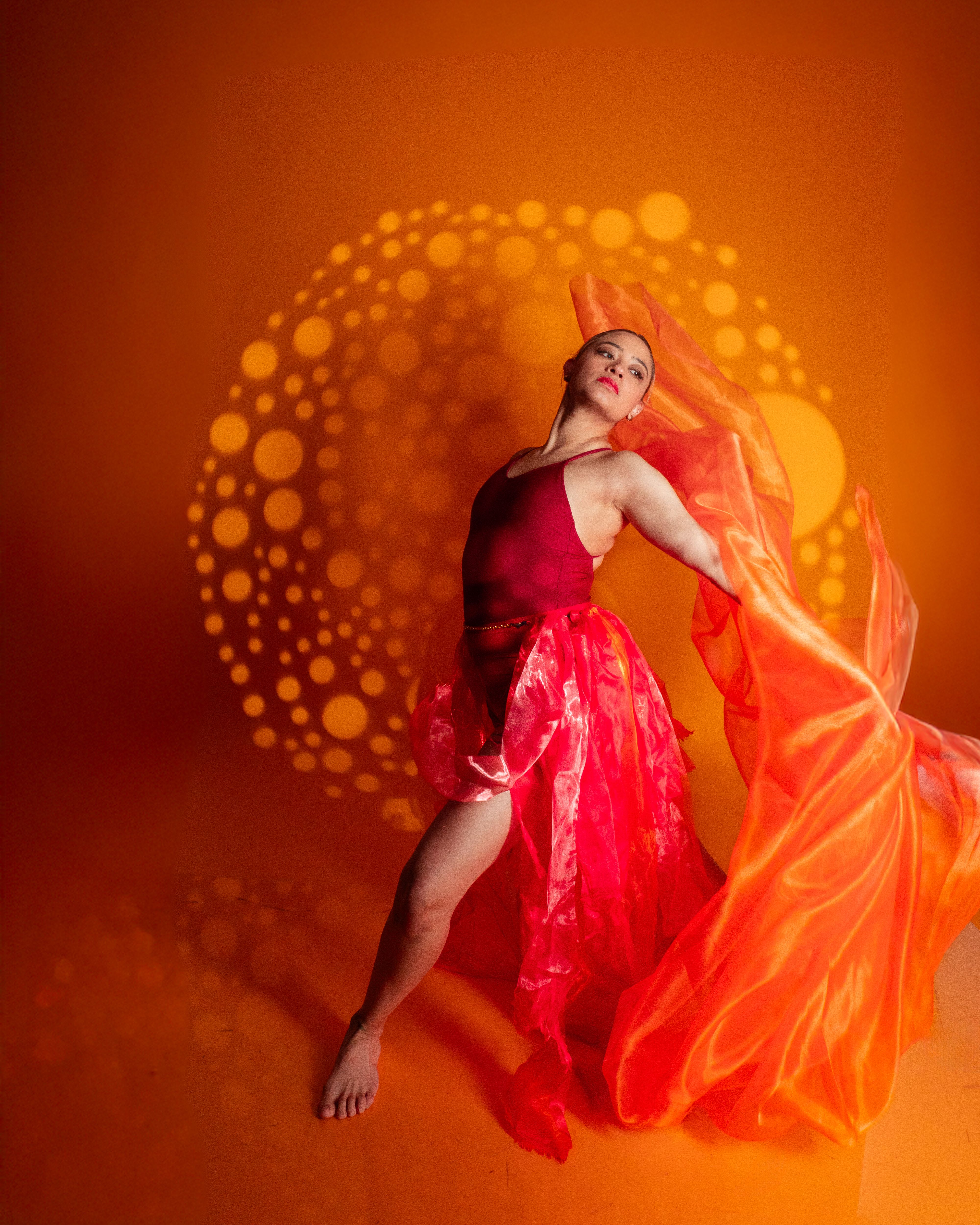 Elegant Contemporary Dancer in Vibrant Orange Attire · Free Stock Photo