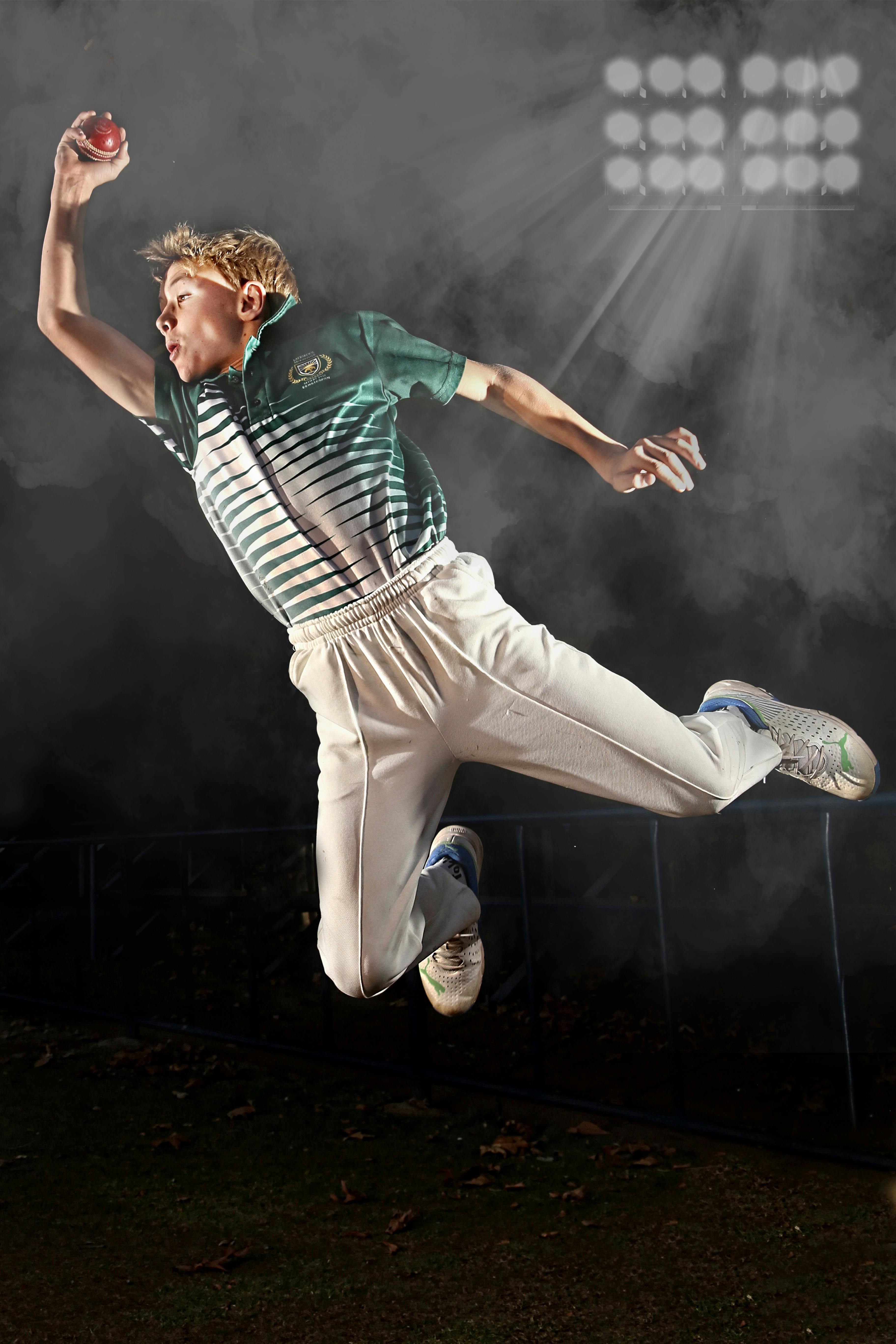 Dynamic Action Shot of Cricketer in Mid-Air · Free Stock Photo