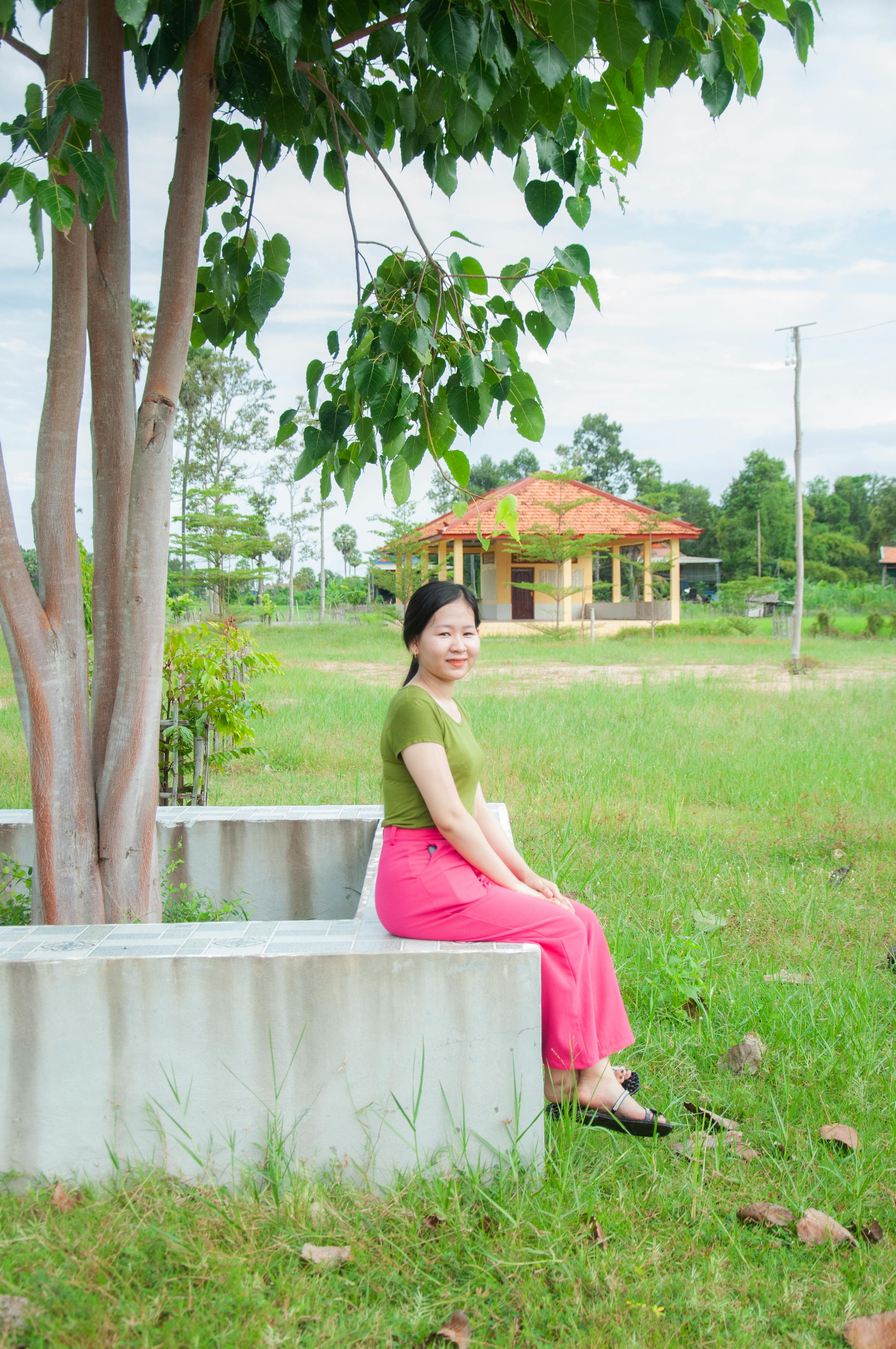 Charming Portrait of a Woman Outdoors by a Tree · Free Stock Photo