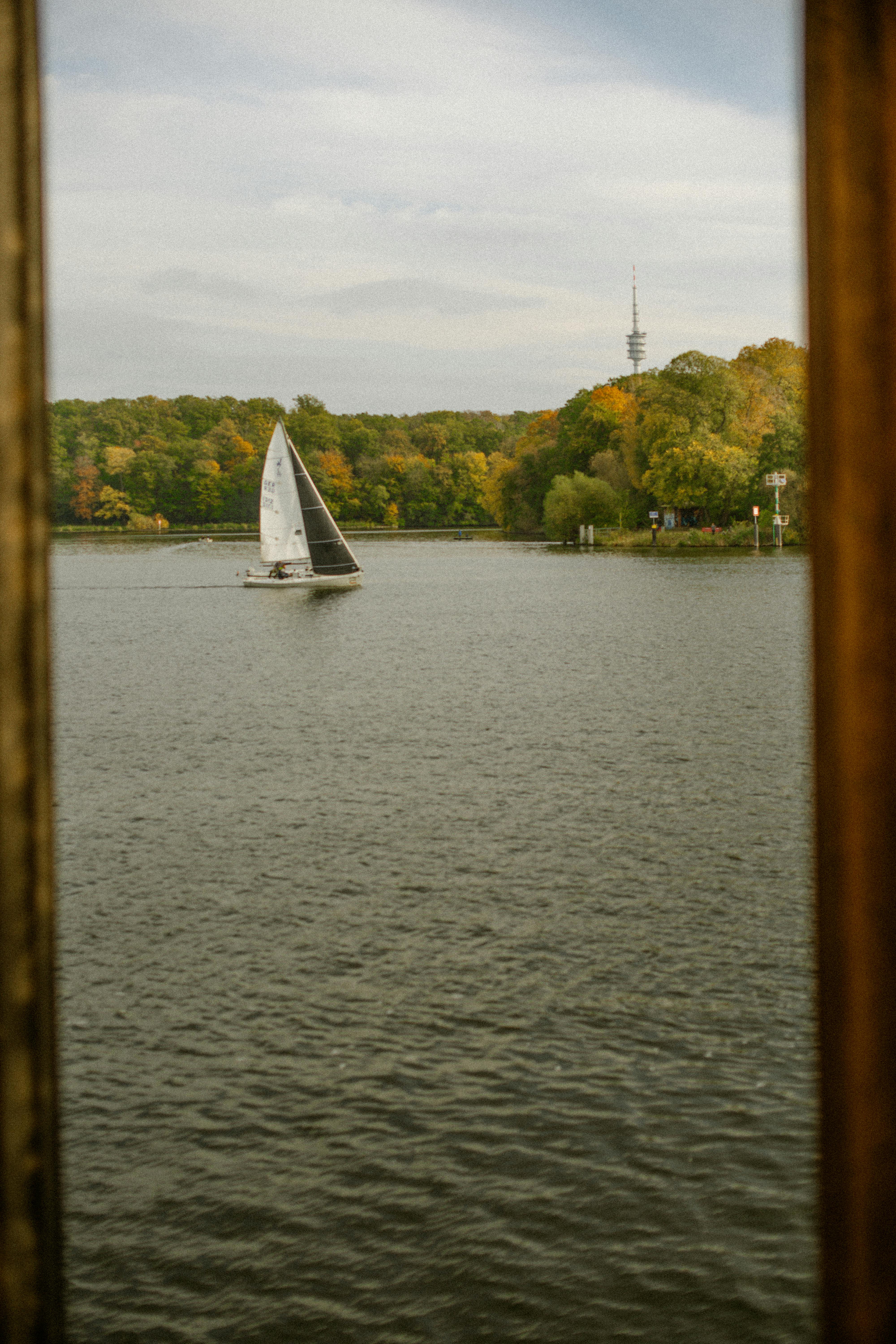 Sailboat on Lake with Autumn Foliage · Free Stock Photo