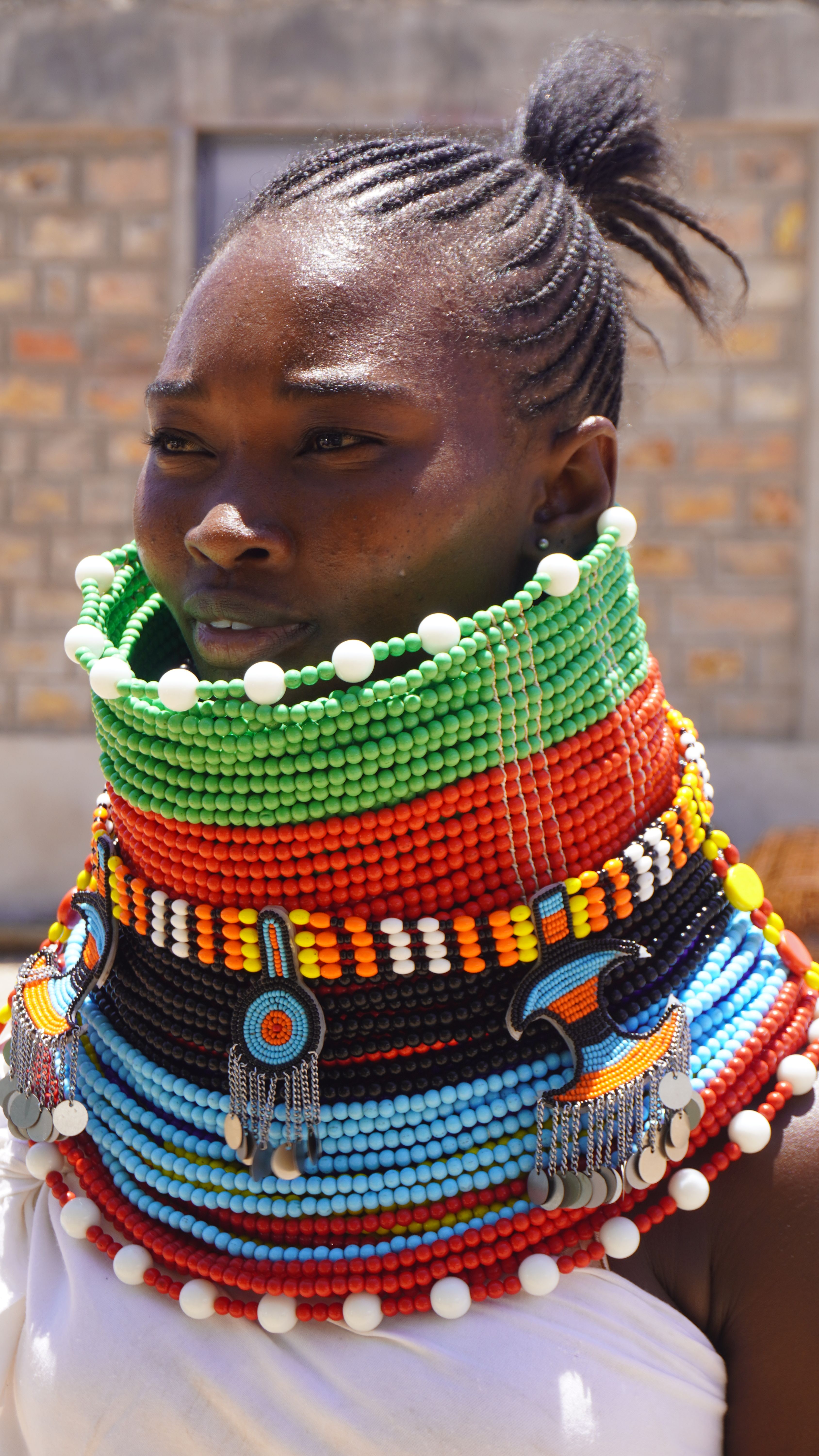 Portrait of a Woman in Traditional African Beaded Attire · Free Stock Photo