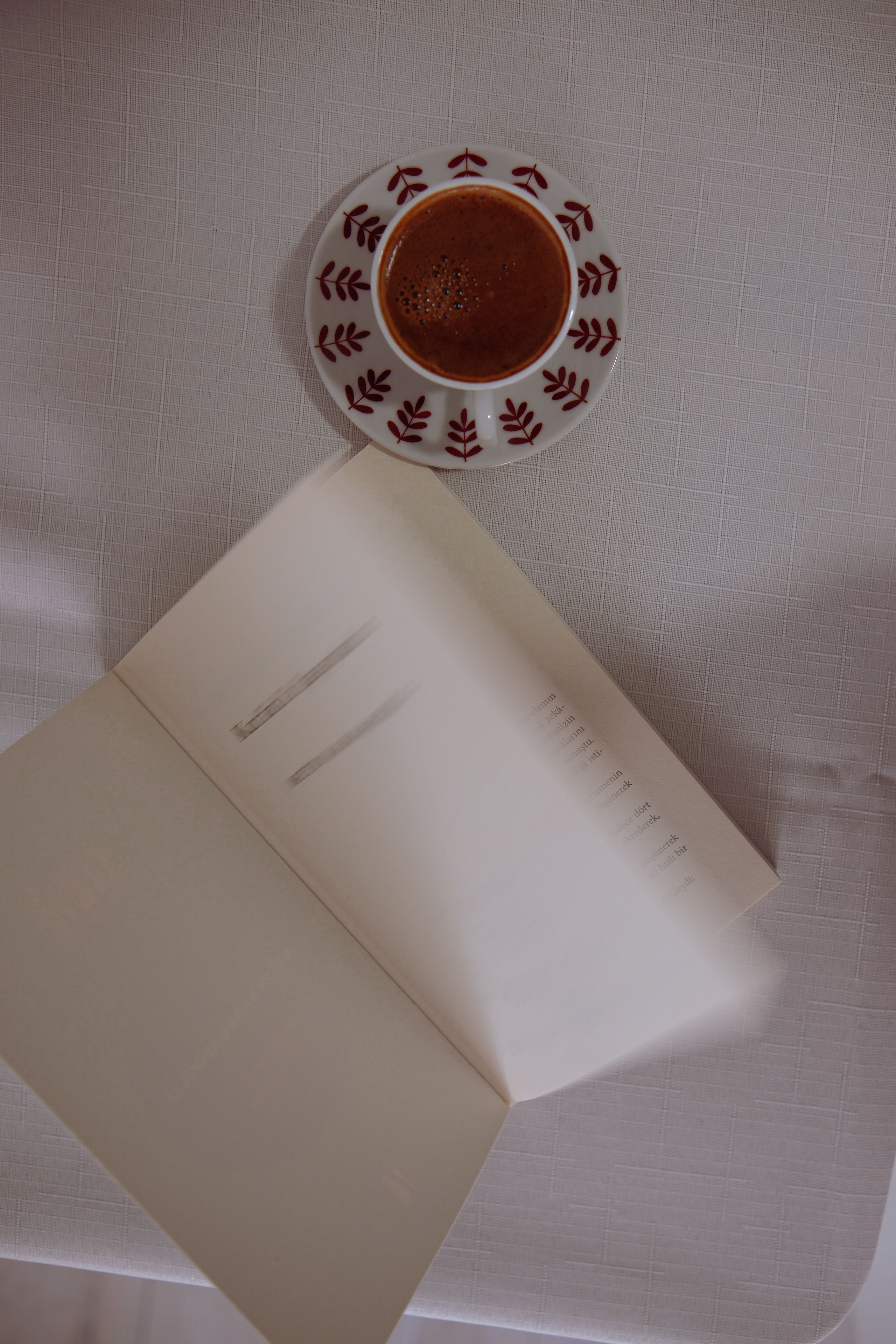 Cozy Coffee and Open Book on Tabletop · Free Stock Photo