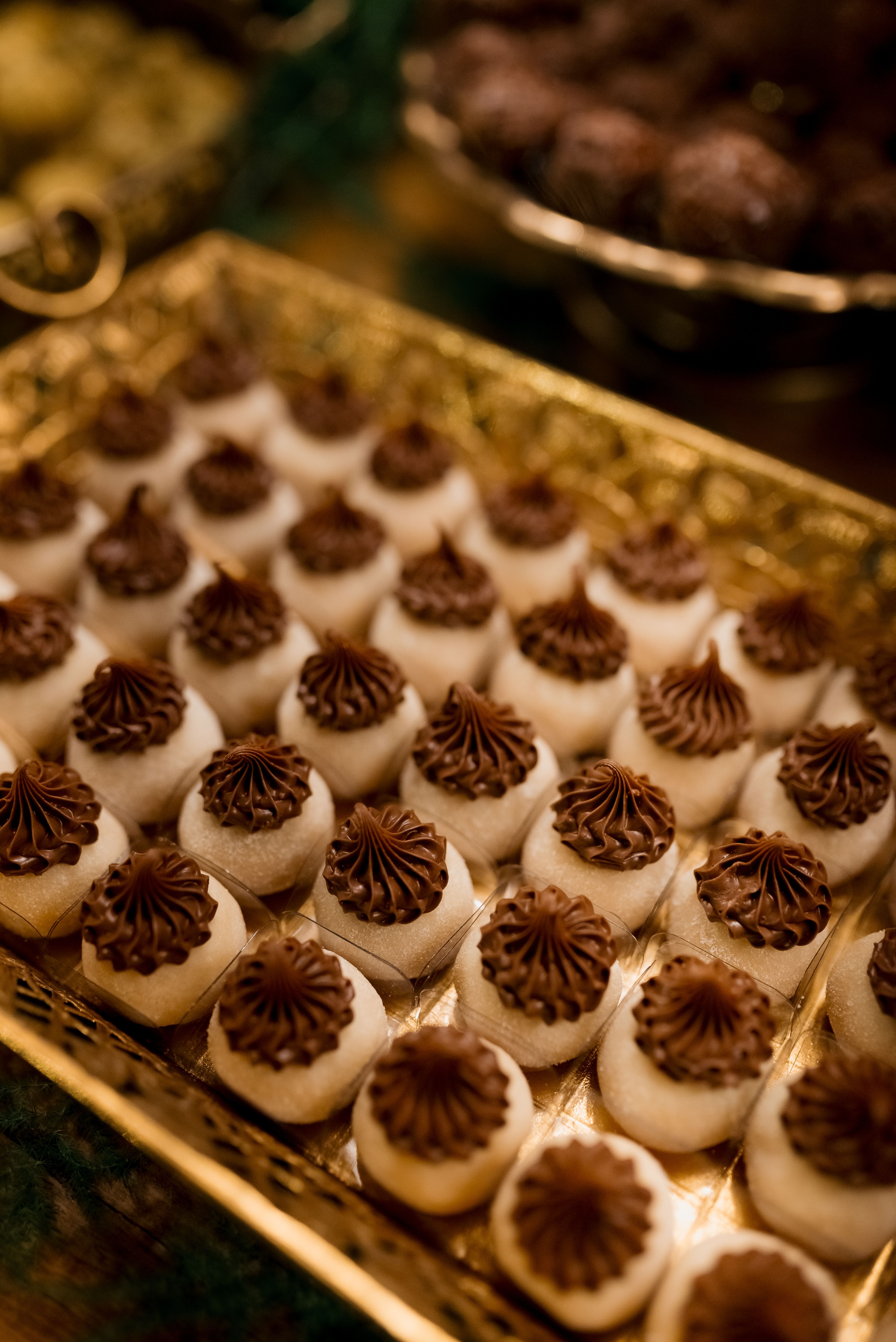 Elegant Chocolate Topped Mini Desserts Displayed · Free Stock Photo