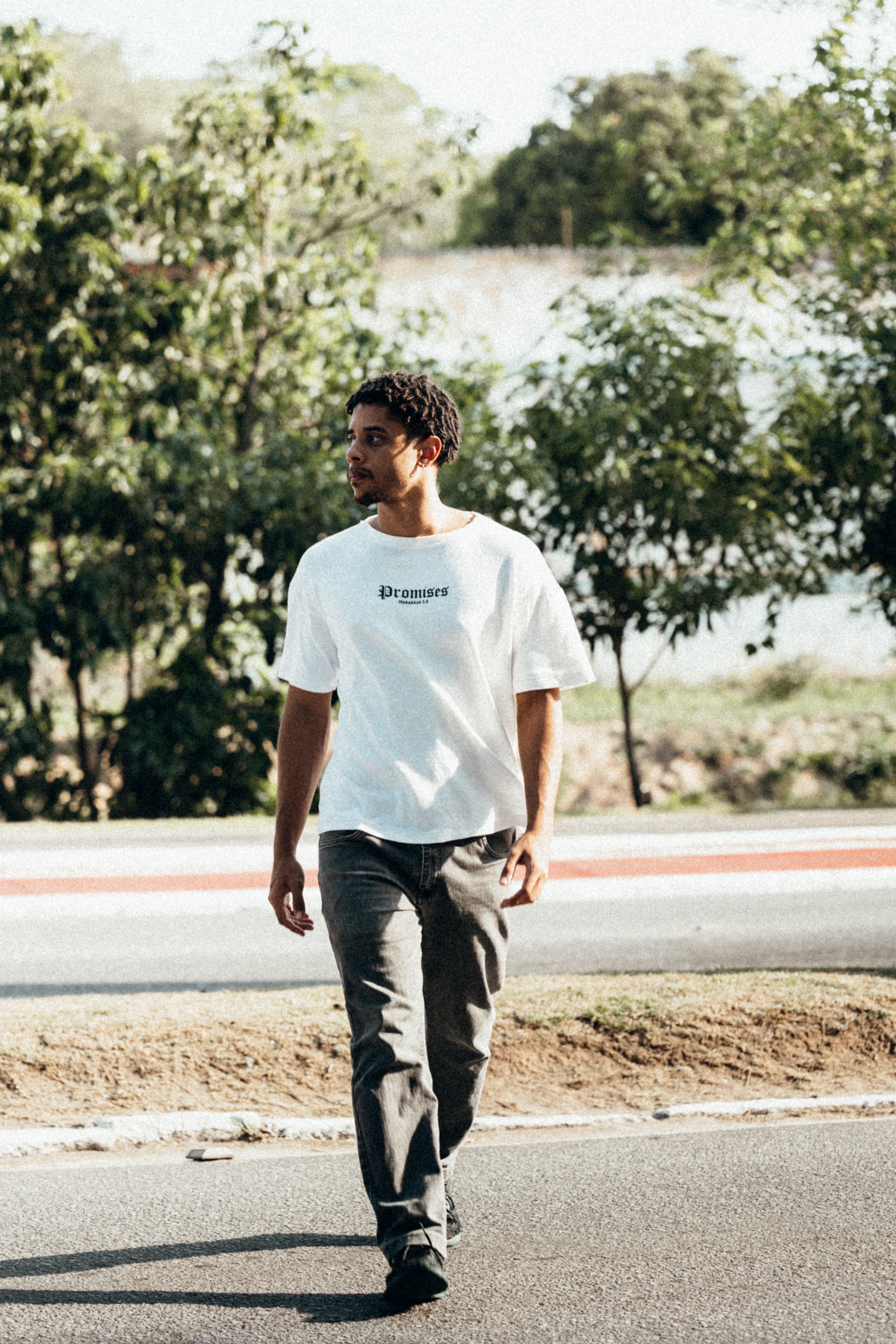 Man Walking on Road Under the Sun · Free Stock Photo