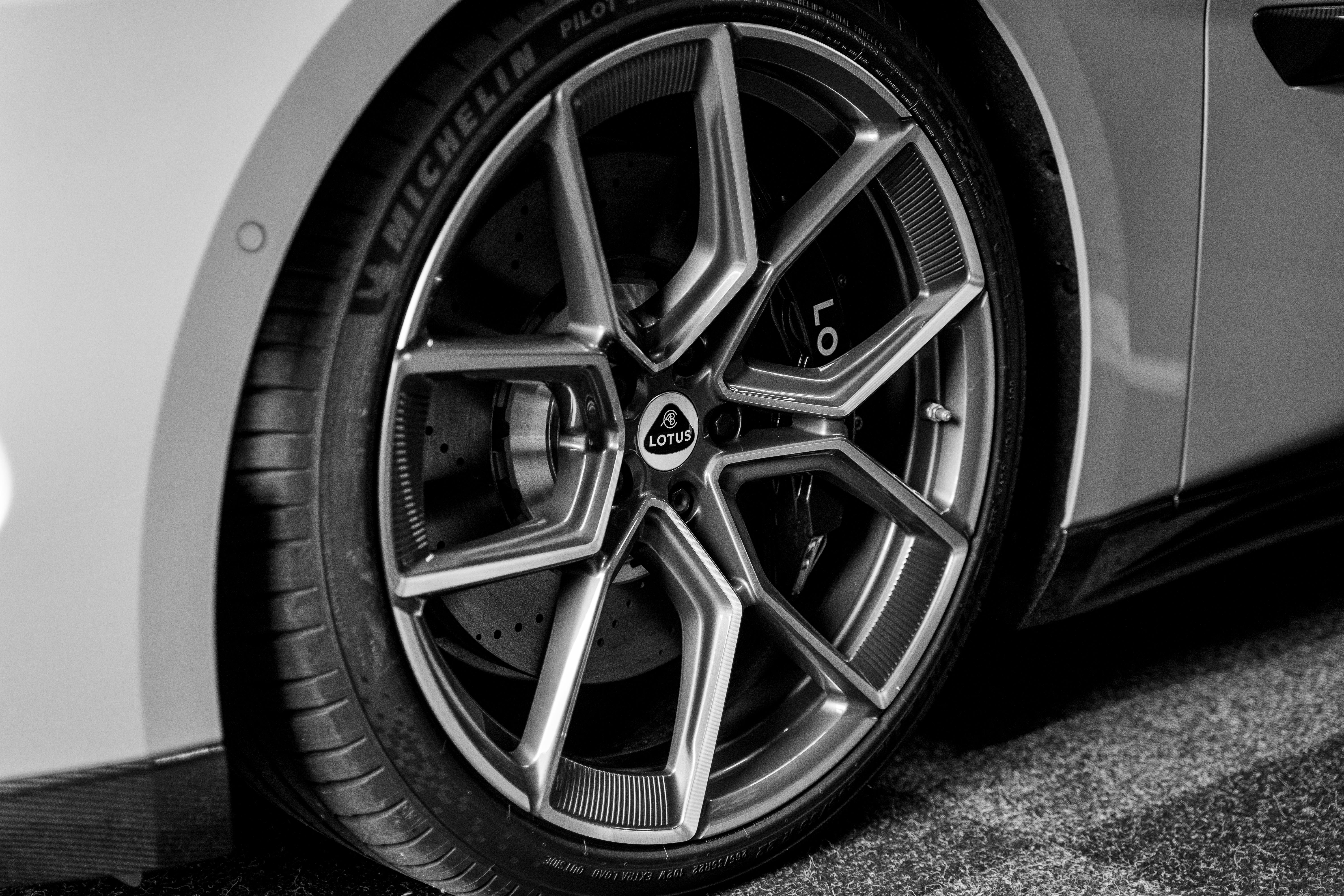Close-up of Lotus Car Wheel in Black and White · Free Stock Photo