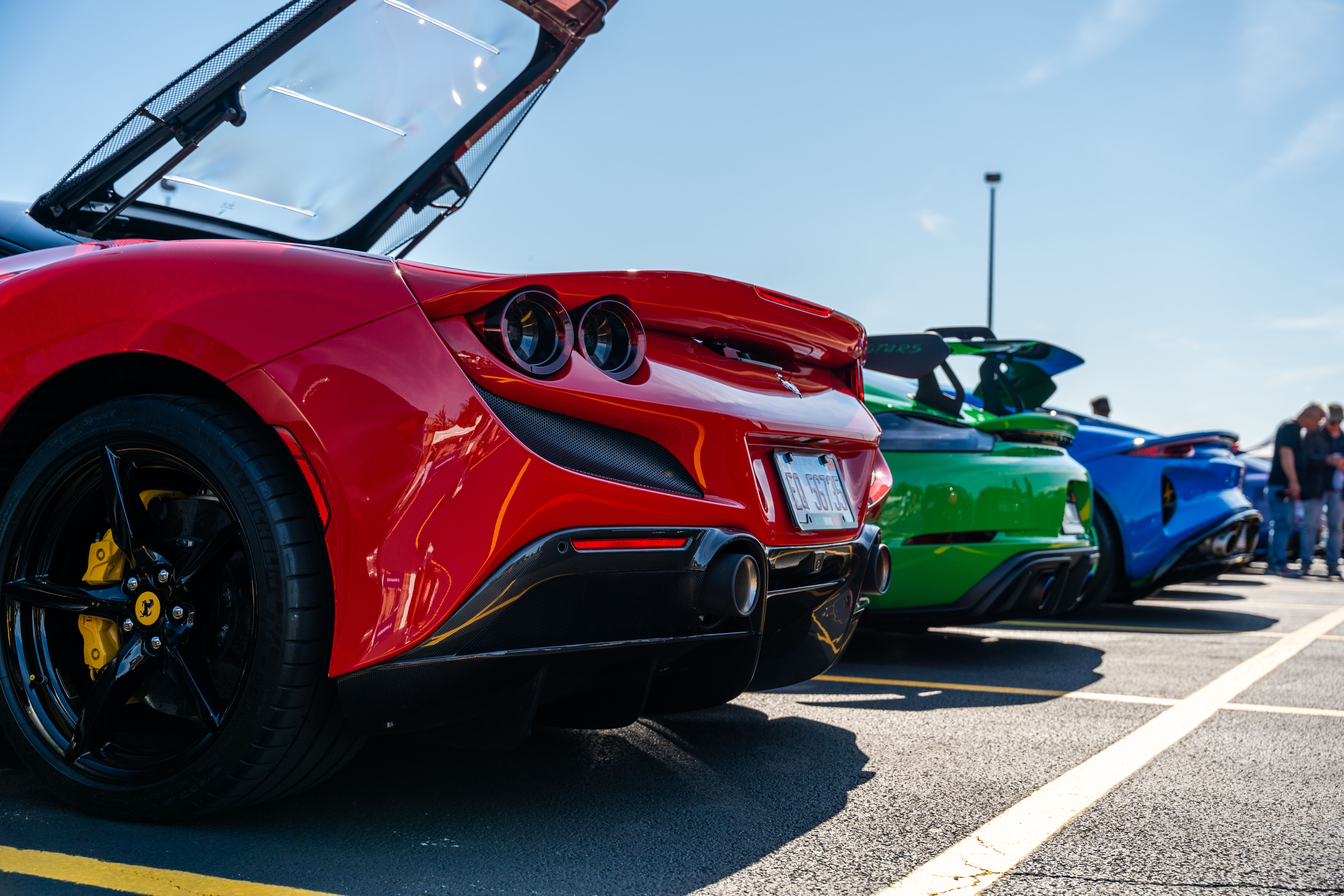 Luxury Sports Cars Parked at a Scenic Lot · Free Stock Photo