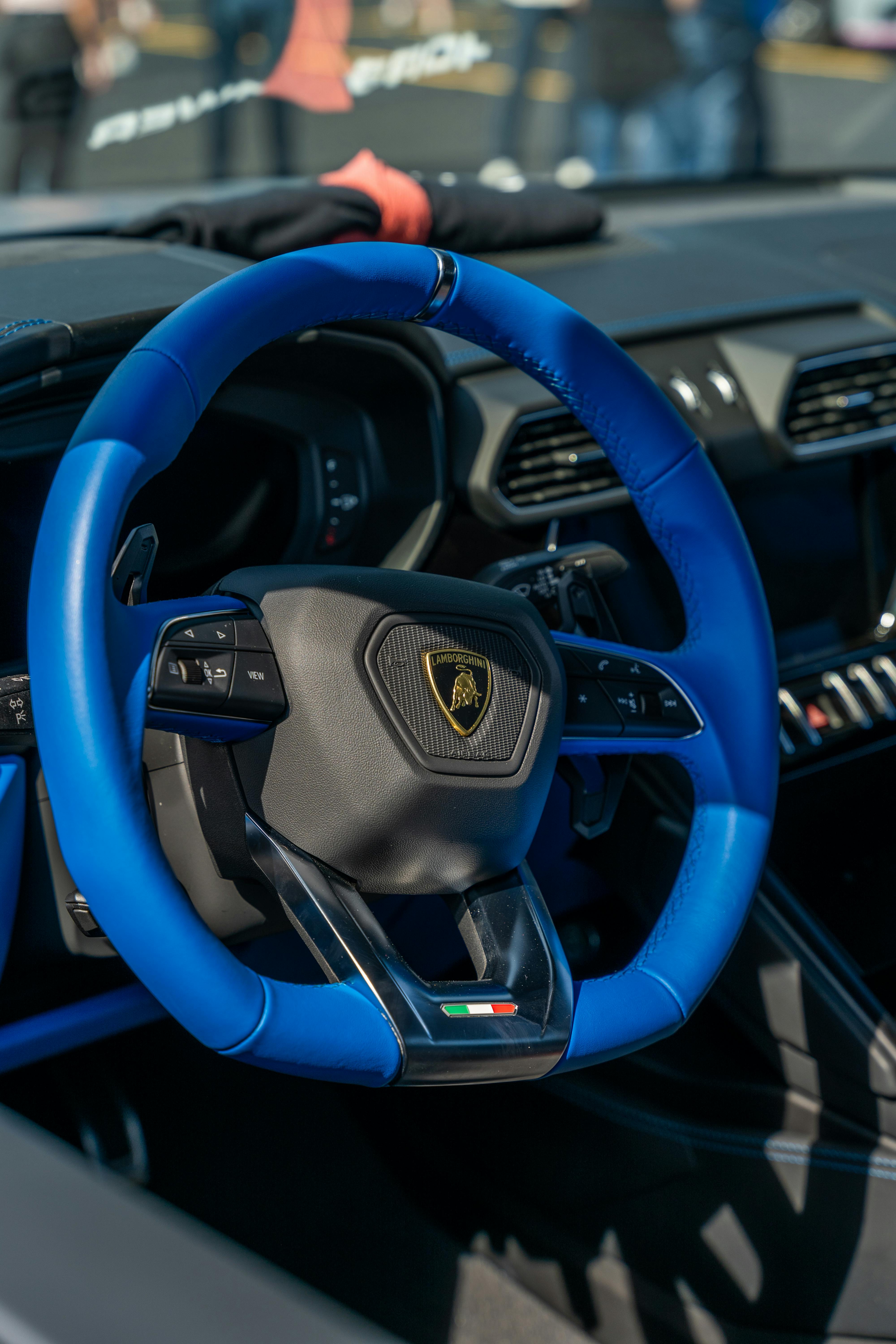 Luxury Sports Car Steering Wheel Close-Up · Free Stock Photo