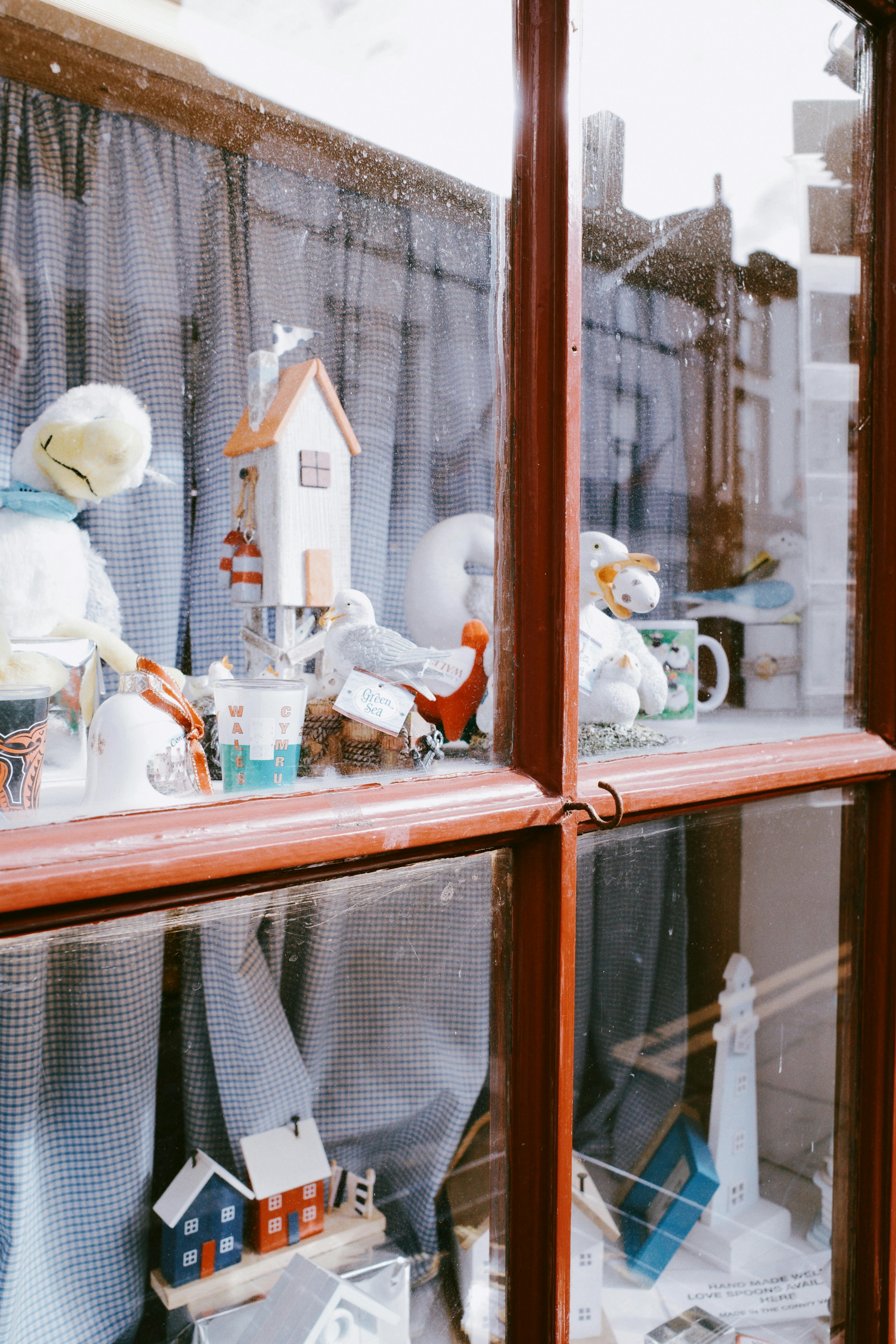 Charming Toy Display in Vintage Shop Window · Free Stock Photo