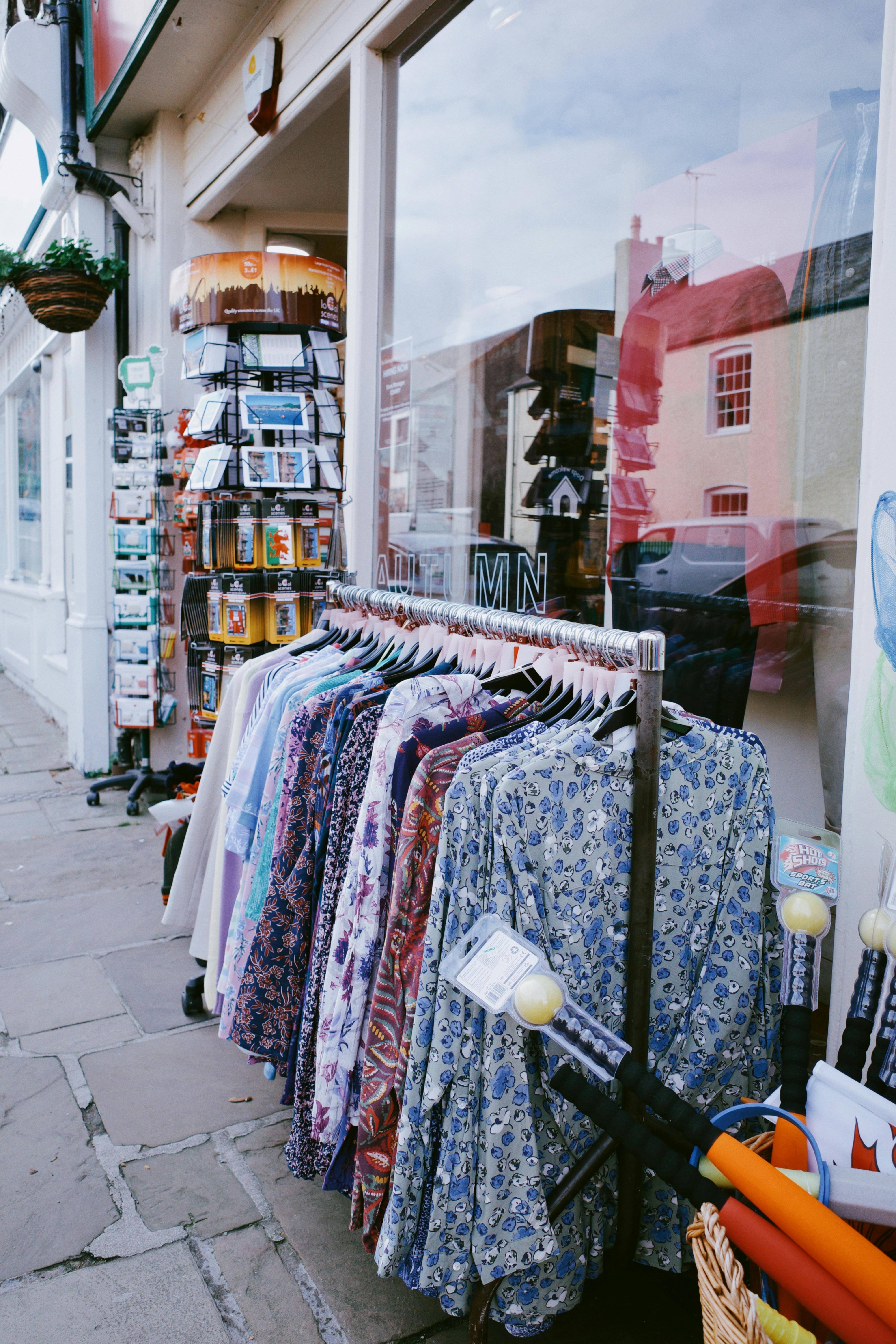 Colorful Clothing Display on Quaint Street · Free Stock Photo
