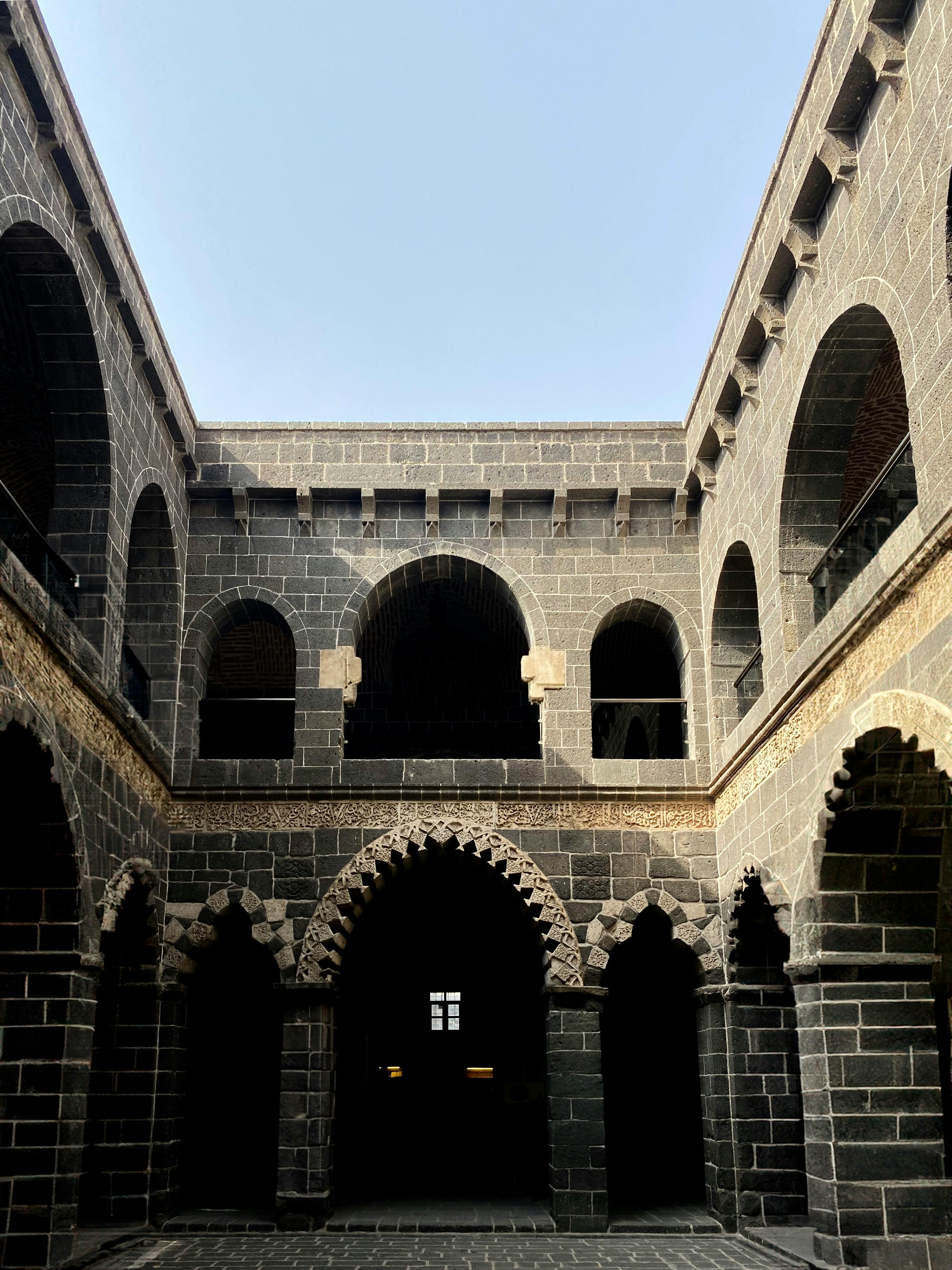 Ancient Stone Architecture with Arched Design · Free Stock Photo