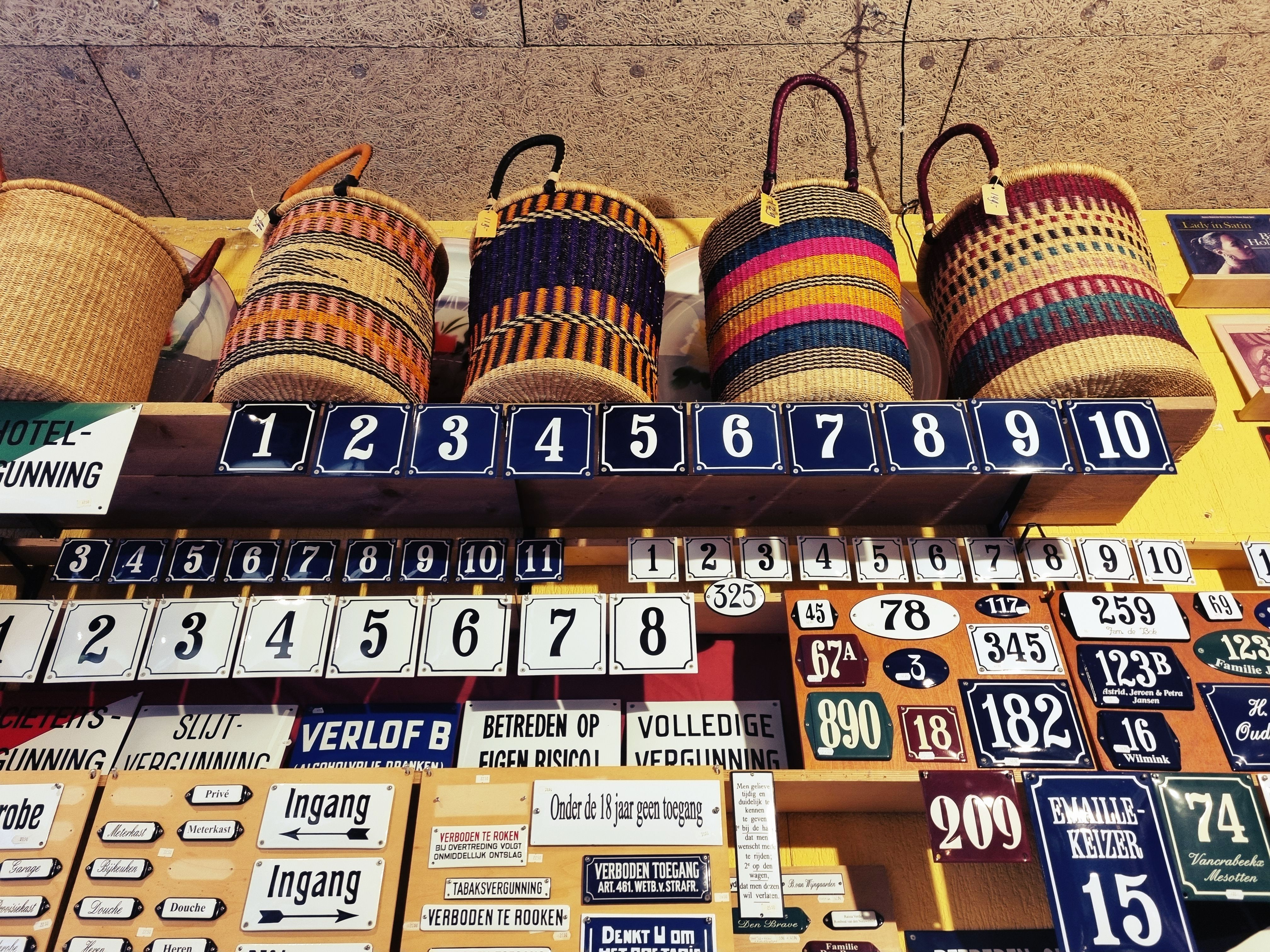 Colorful Baskets and Number Plates Display · Free Stock Photo