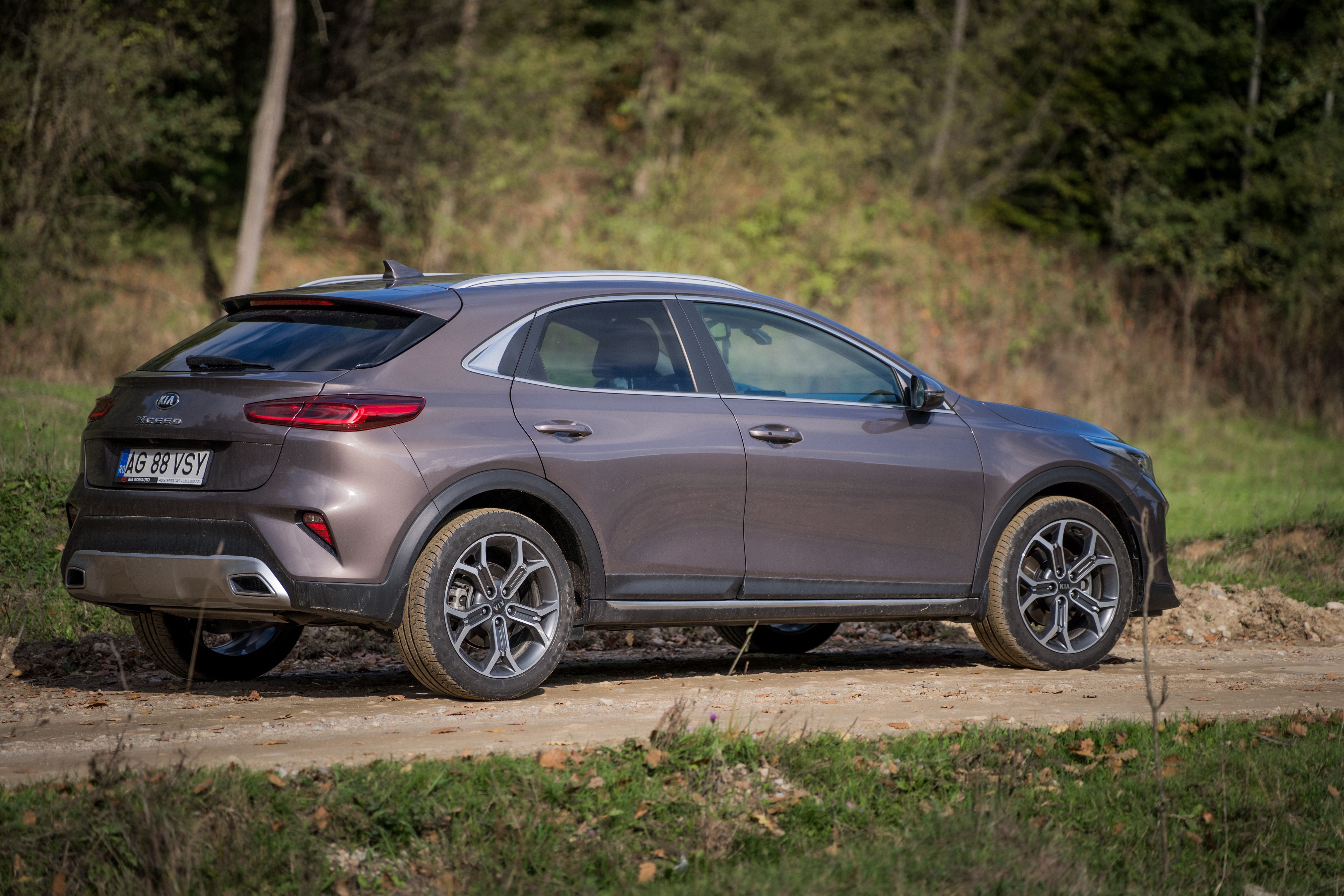 Modern Crossover SUV on Rural Dirt Road · Free Stock Photo