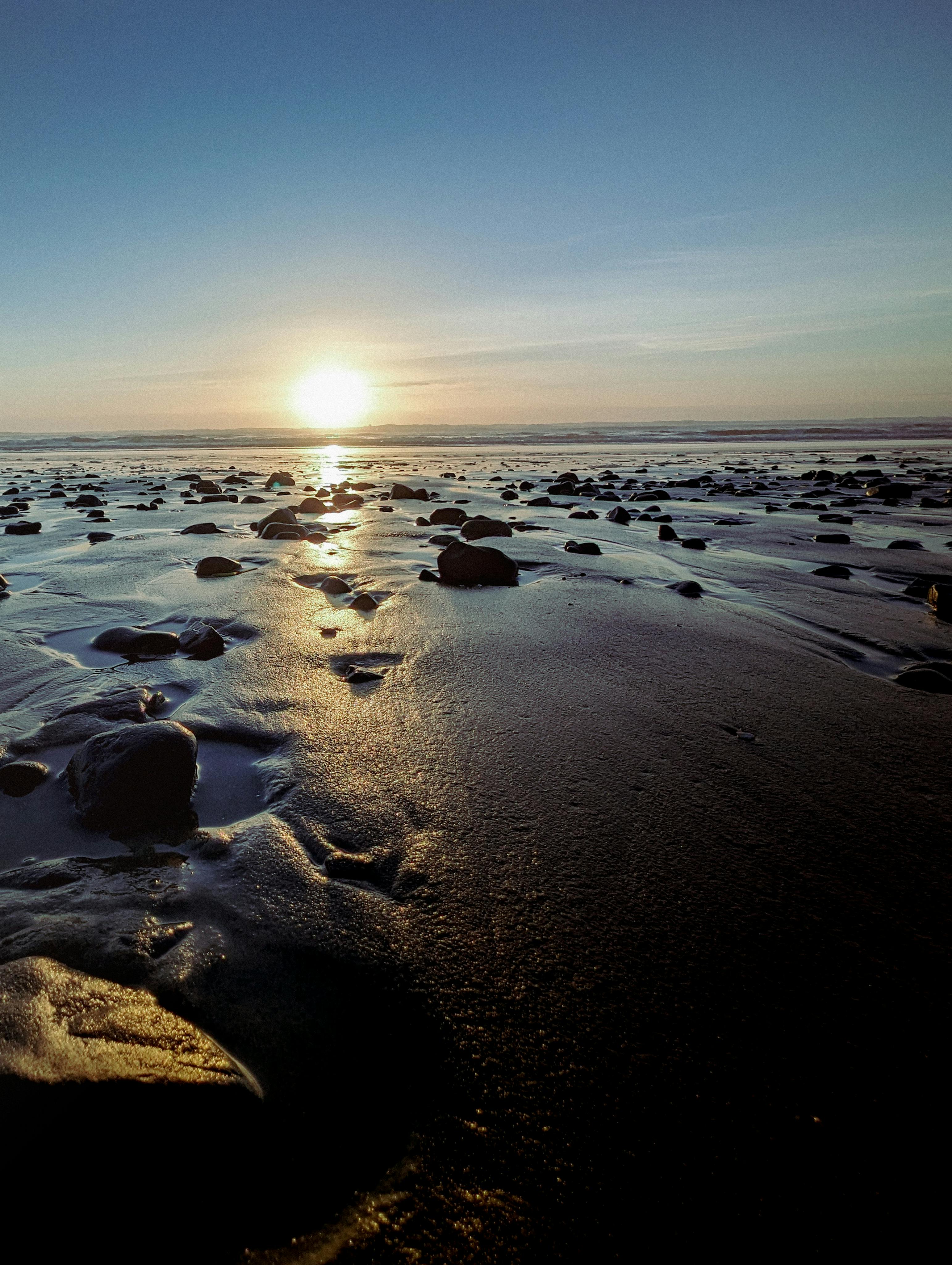 Scenic Oregon Beach Sunset with Rocky Shoreline · Free Stock Photo