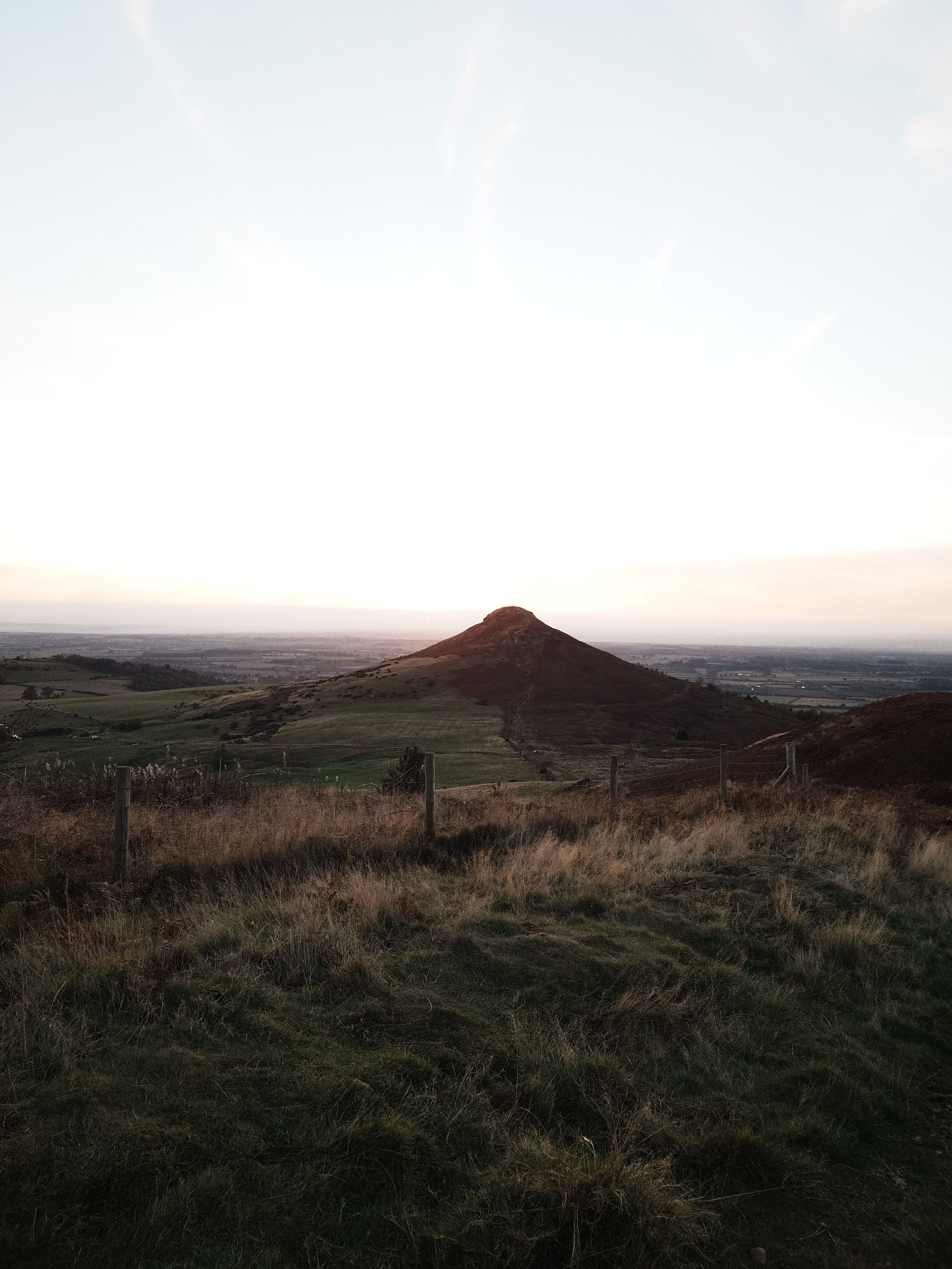 Scenic Hill at Sunset in Serene Landscape · Free Stock Photo
