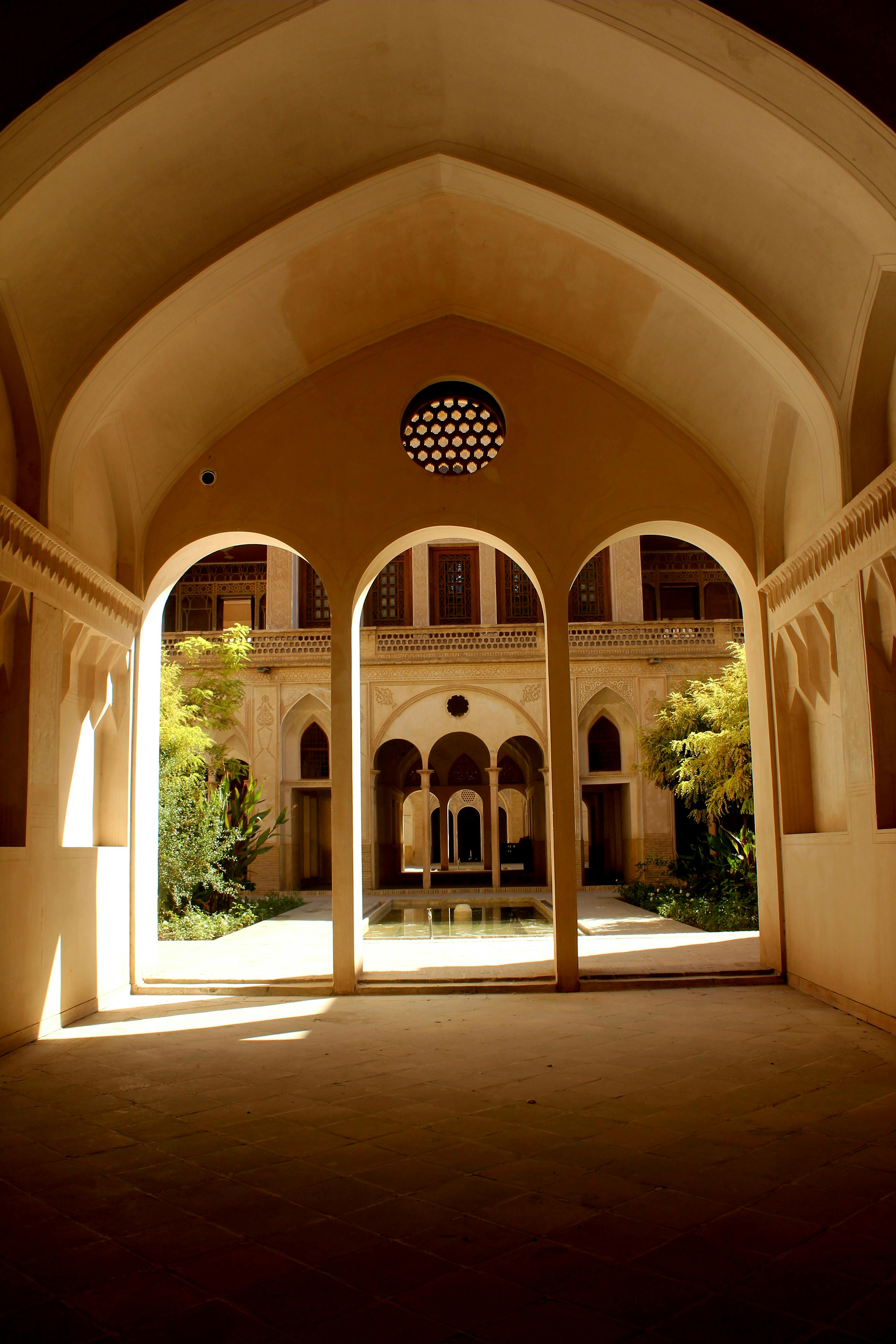 Historic Courtyard with Dramatic Archways · Free Stock Photo