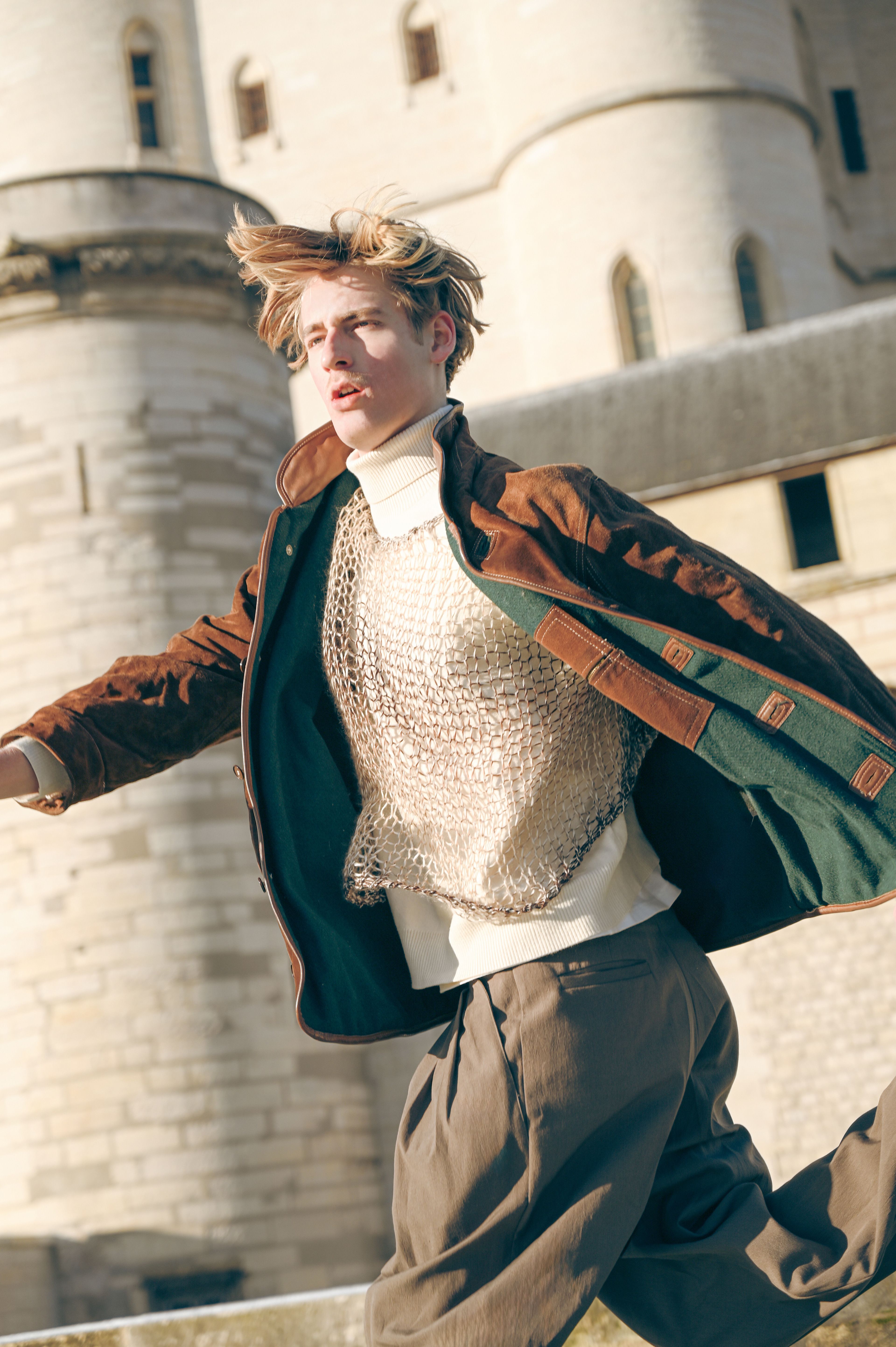 Fashionable Young Man Running by Medieval Building · Free Stock Photo