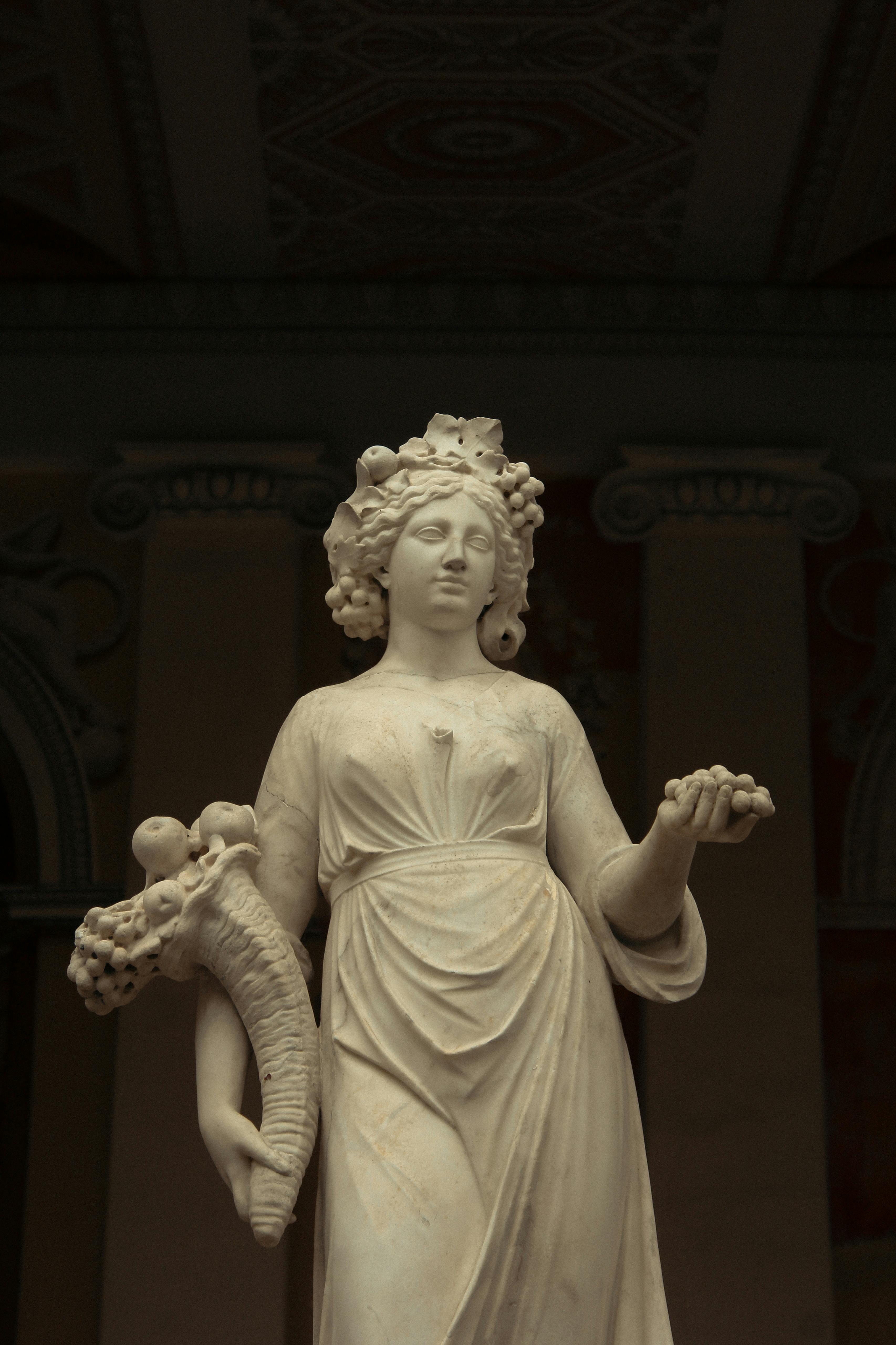 Classical Marble Statue of Woman with Cornucopia · Free Stock Photo