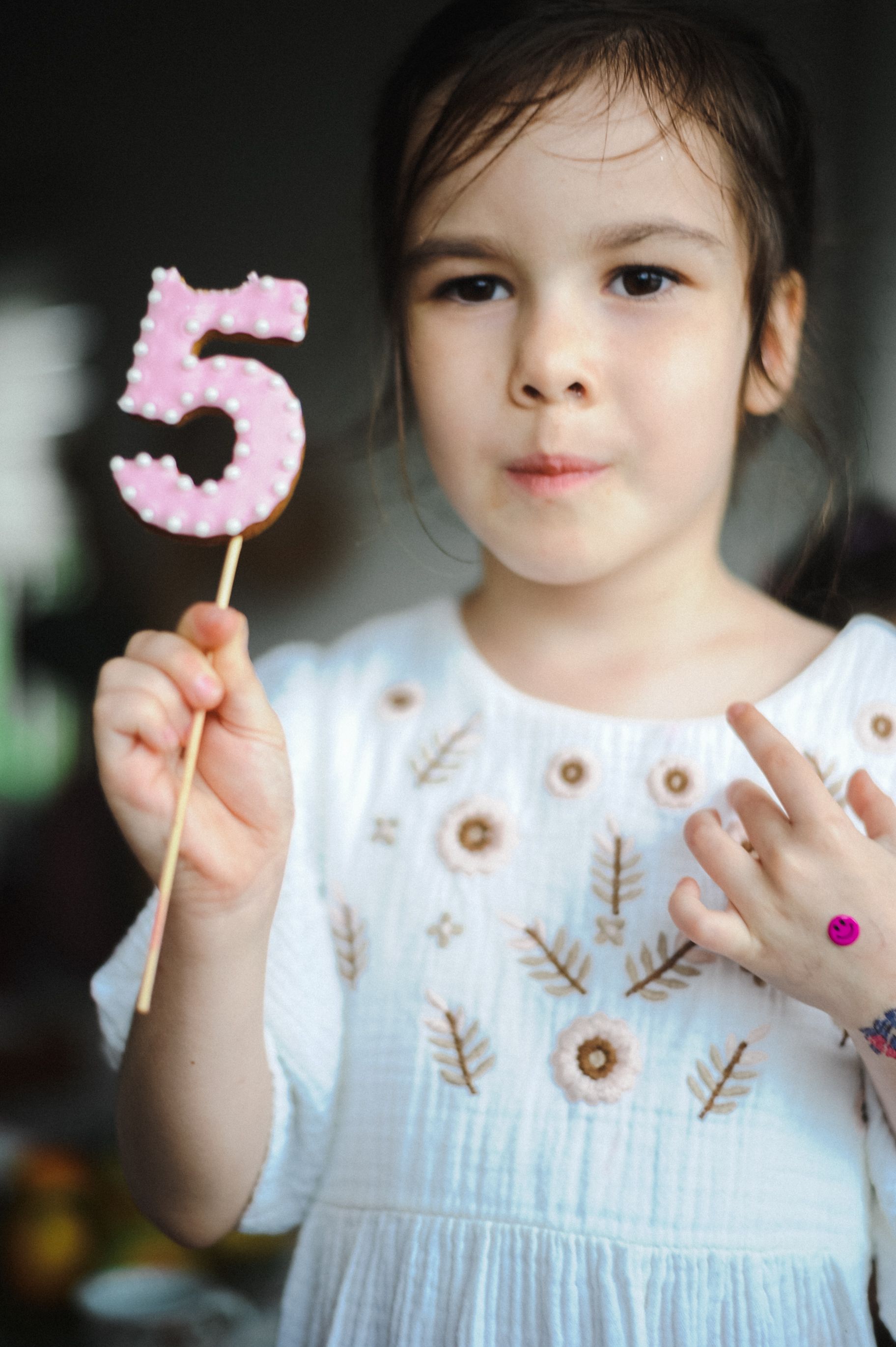 Young Girl Celebrating Fifth Birthday Indoors · Free Stock Photo