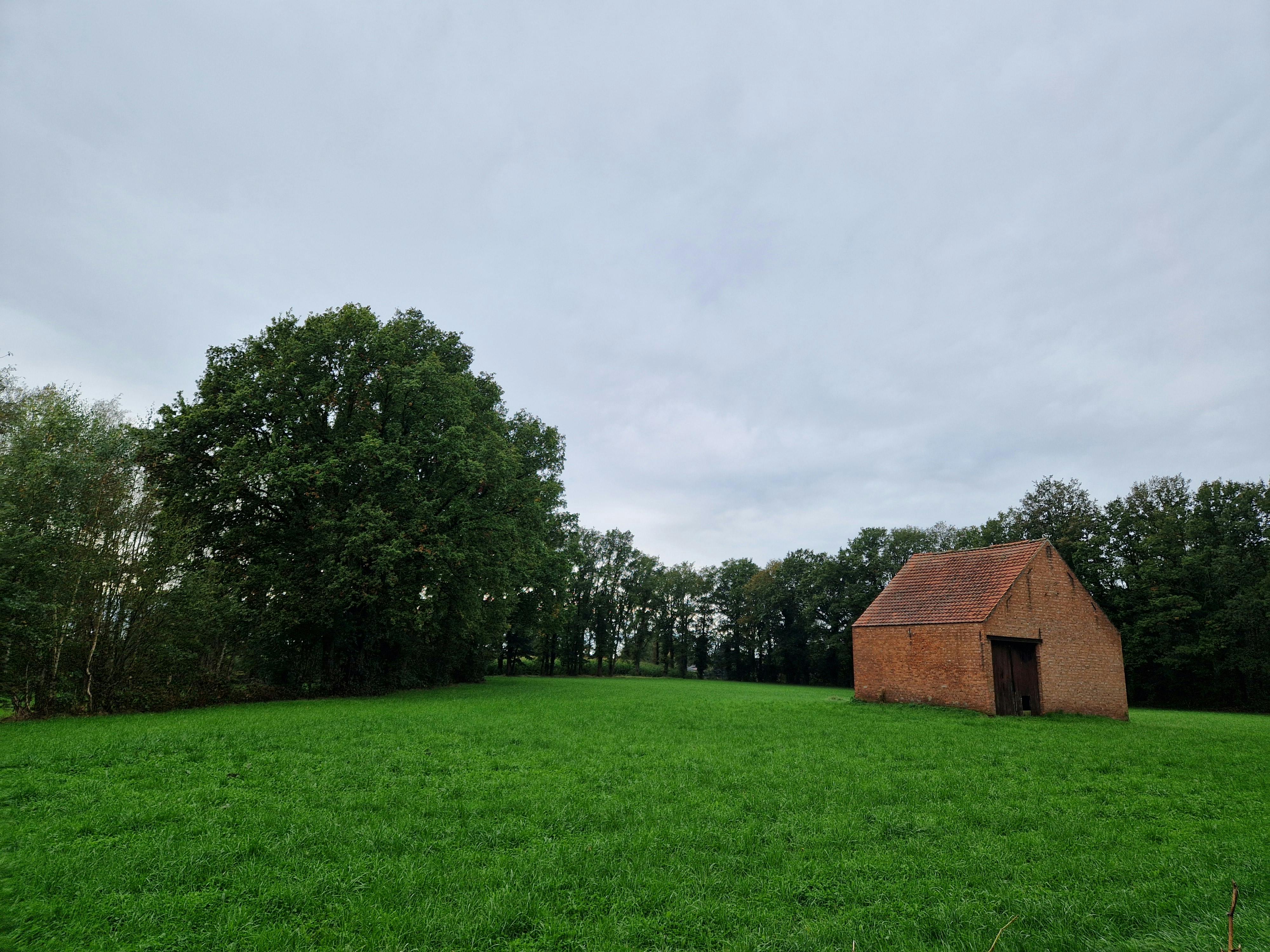 Aerial View of Red and White Painted Barn Near Green Grass Yard · Free ...