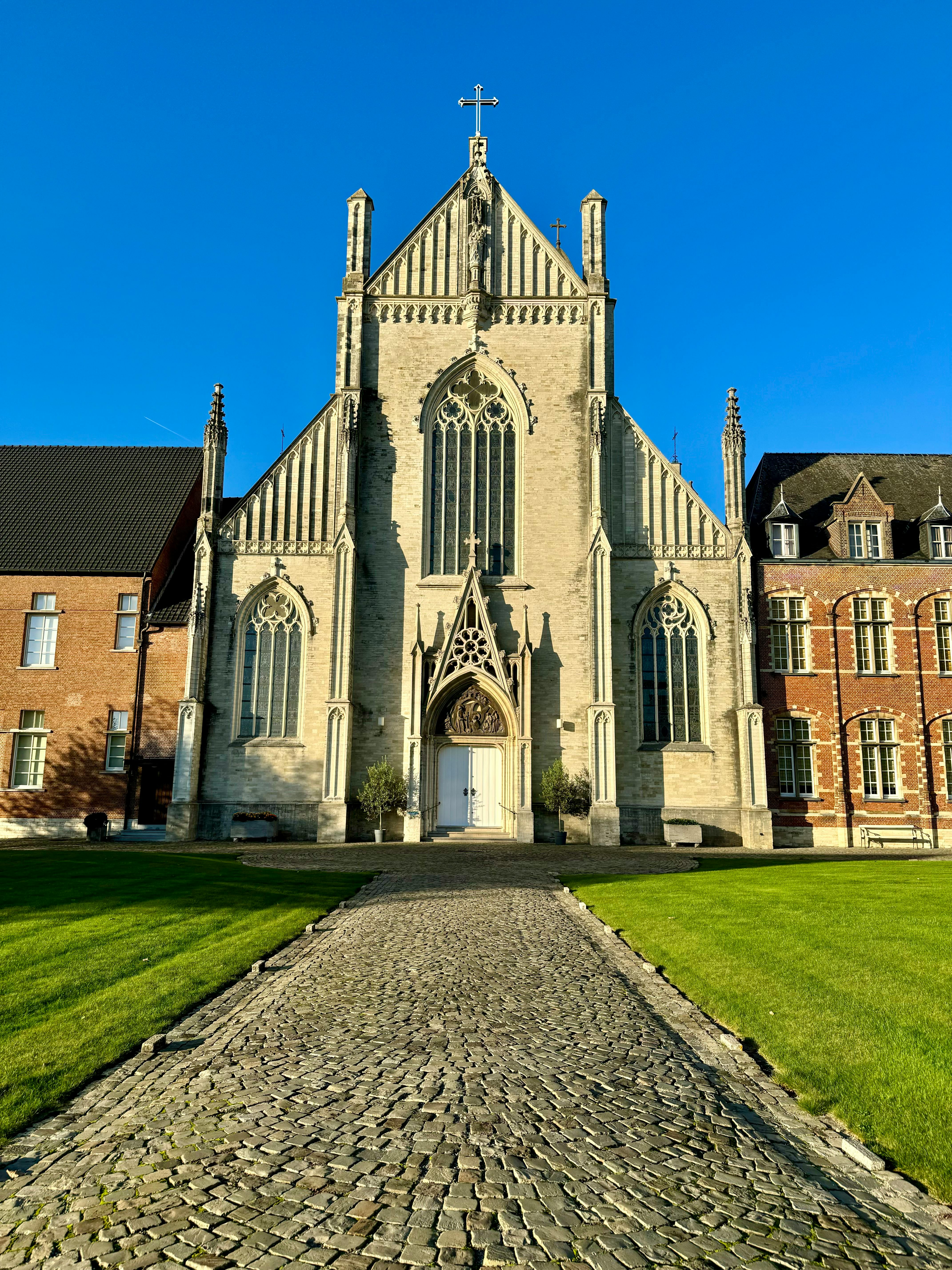 Gothic Cathedral Facade with Blue Sky Background · Free Stock Photo
