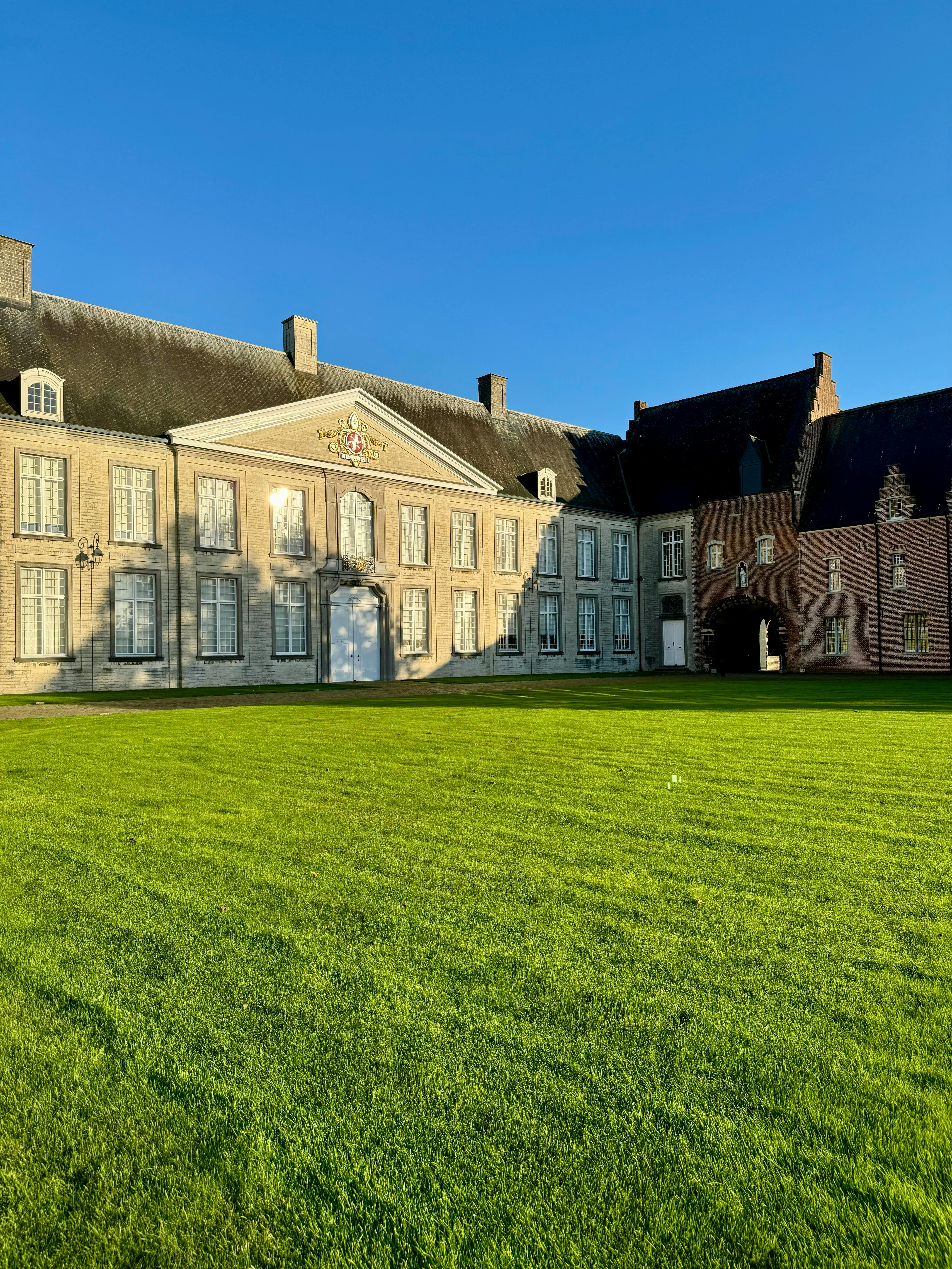 Historic European Chateau with Bright Blue Sky · Free Stock Photo
